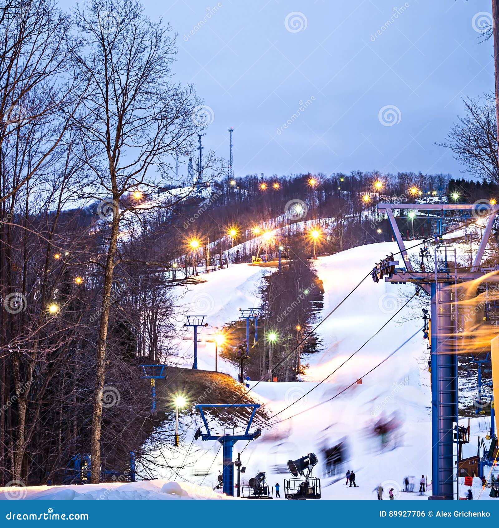 Busy Ski Resort with Open Evening Runs Stock Photo - Image of pylon ...