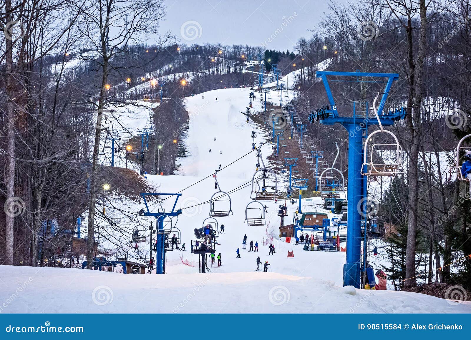 Busy Ski Resort with Open Evening Runs Stock Photo - Image of lift ...