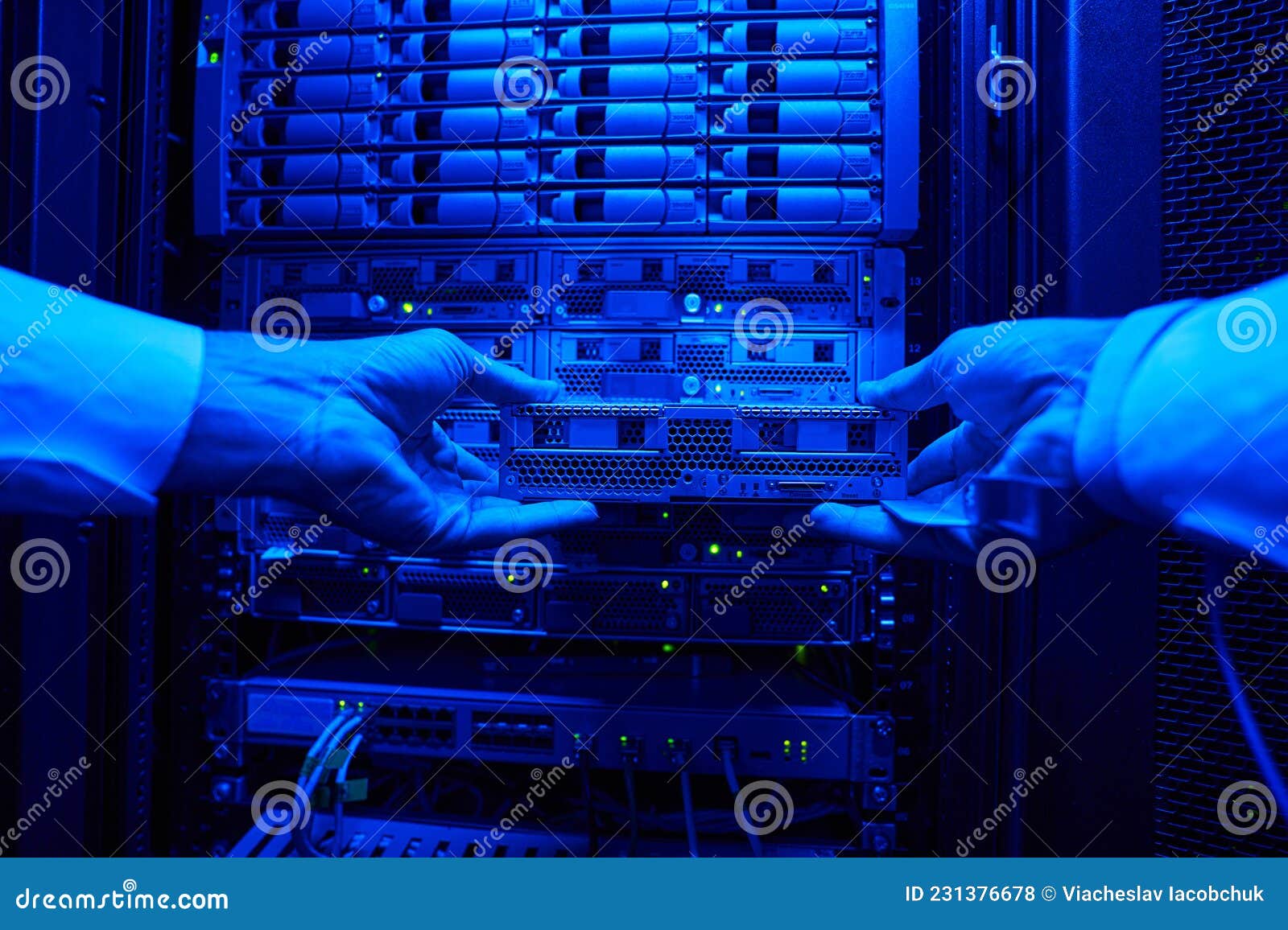 Busy System Administrator Examining Work of Supercomputer in Server ...