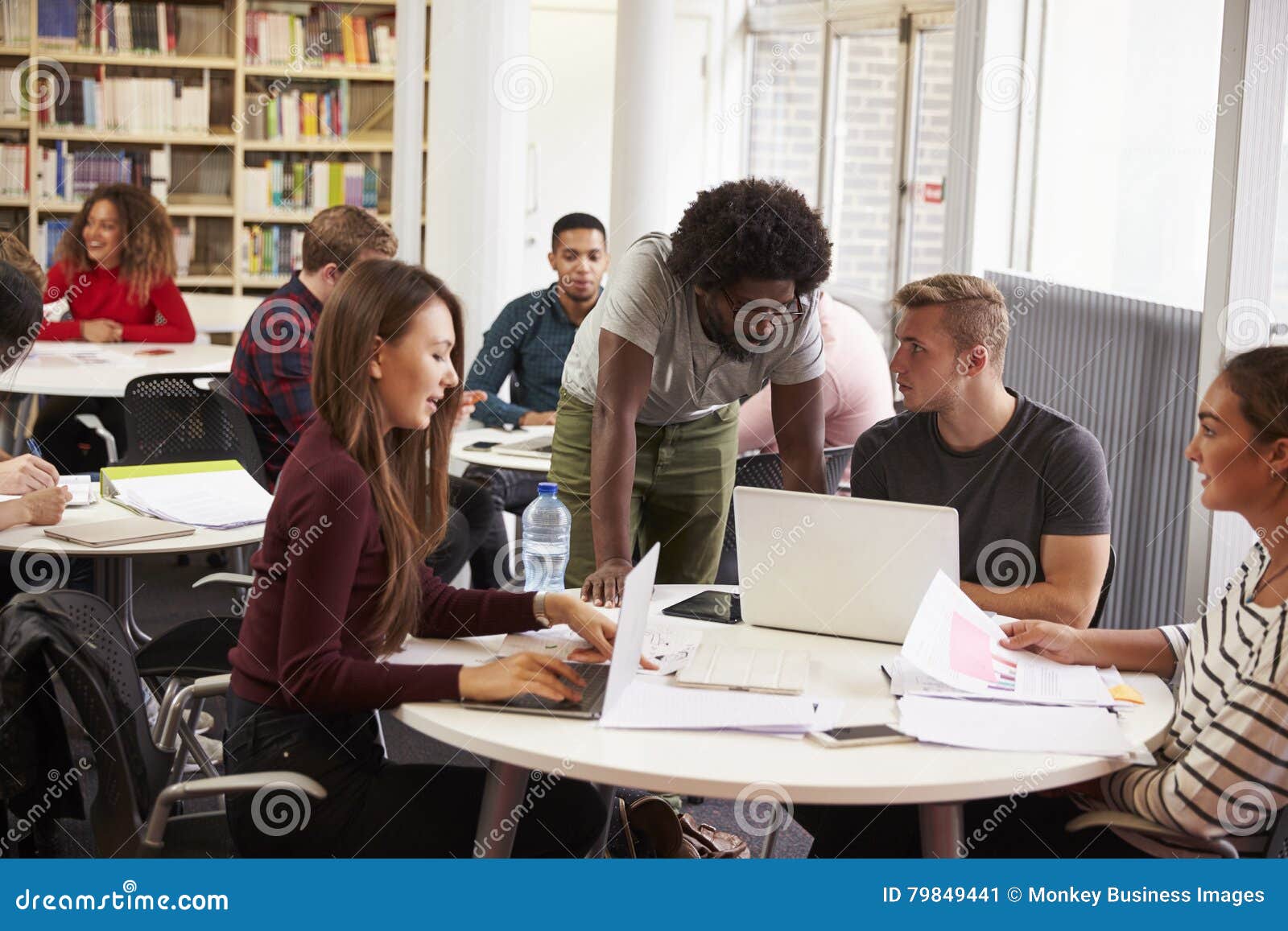 Busy University Library with Students and Tutor Stock Image - Image of ...