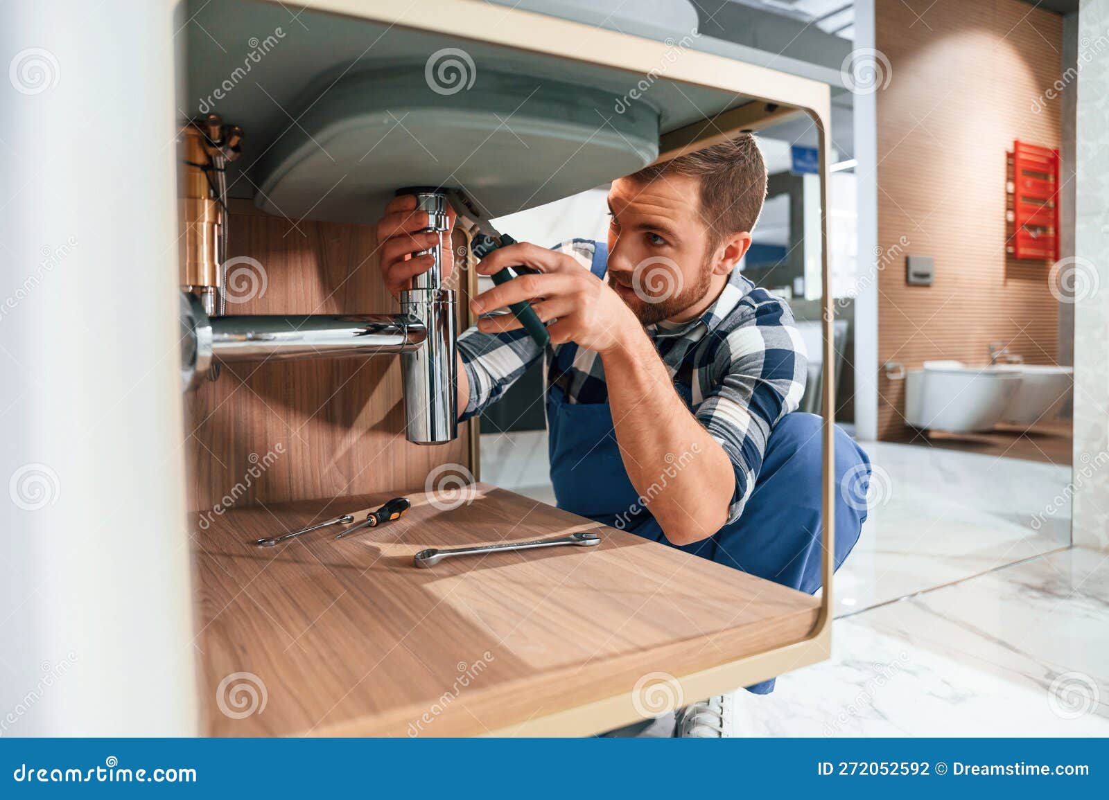 Busy Worker in Blue Uniform is in the Bathroom Stock Photo - Image of ...