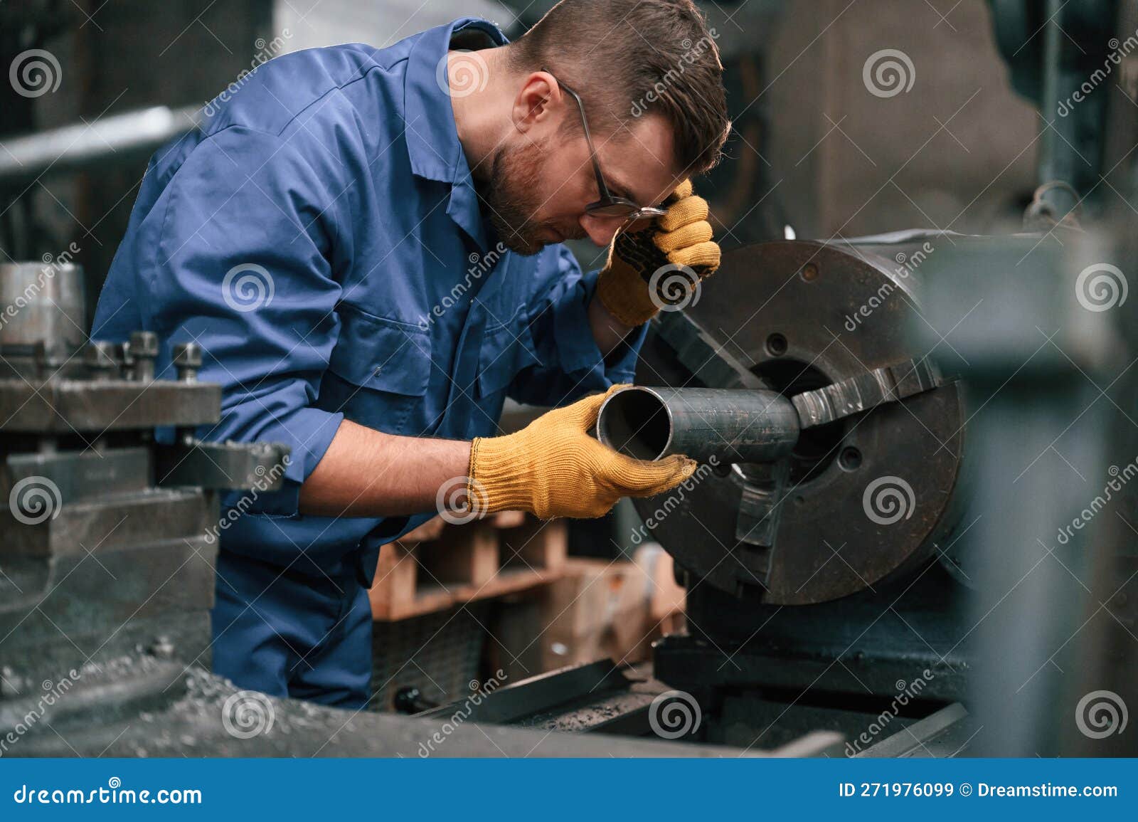 Busy by Working with Automatic Machine. Man at Factory and in Blue ...