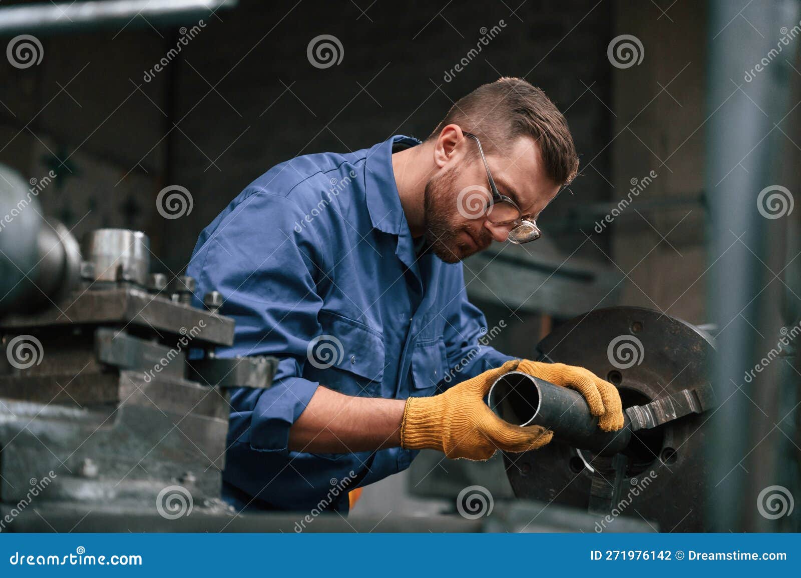 Busy by Working with Automatic Machine. Man at Factory and in Blue ...