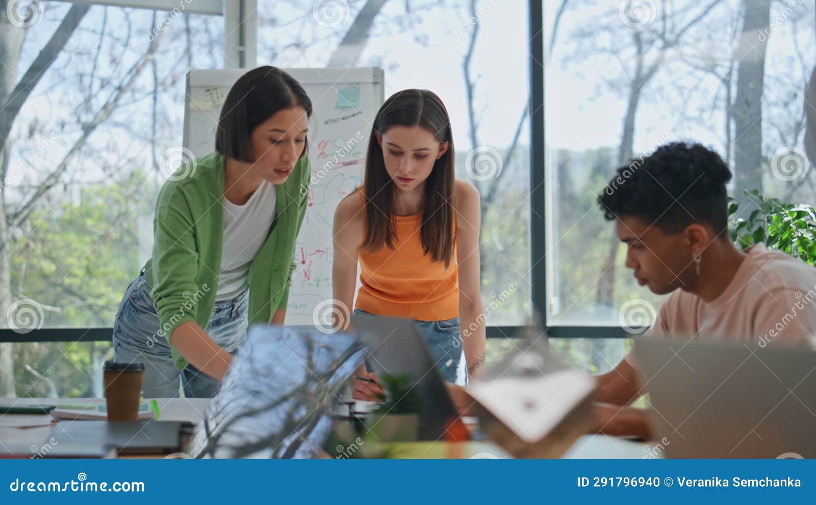 Busy Young Team Working in Workplace Together. Creative Coworkers ...