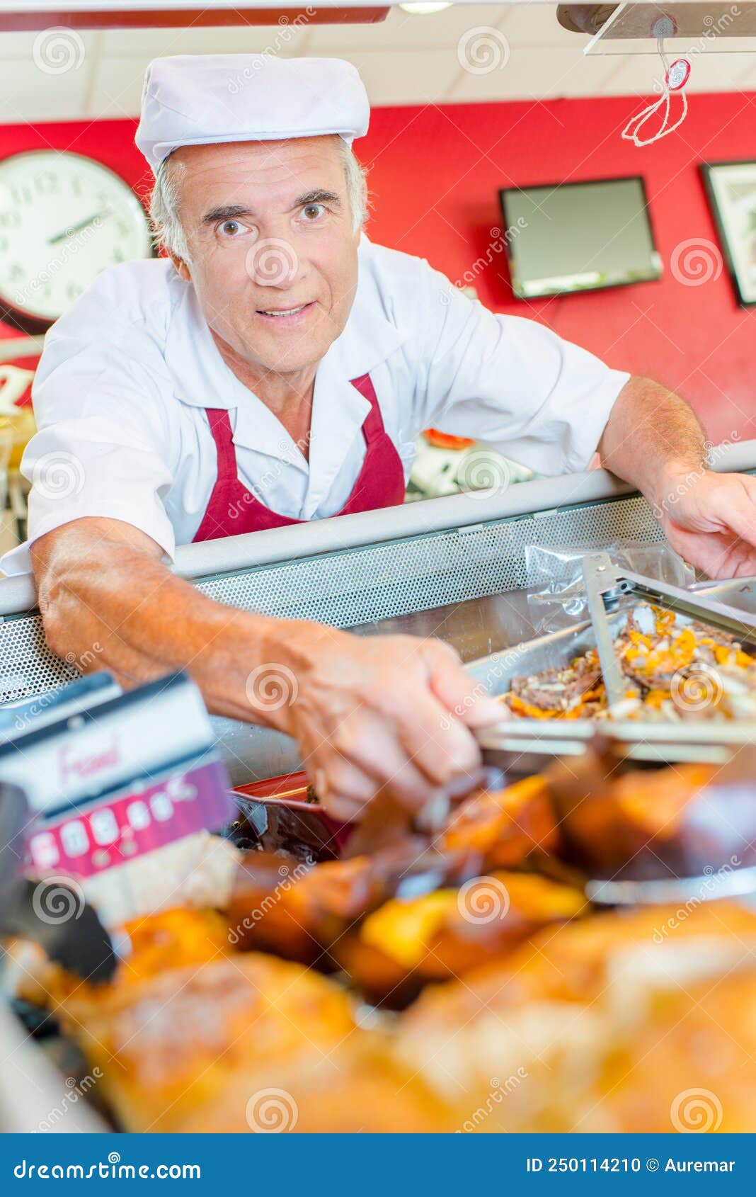 Butcher at counter stock photo. Image of retiree, snack - 250114210