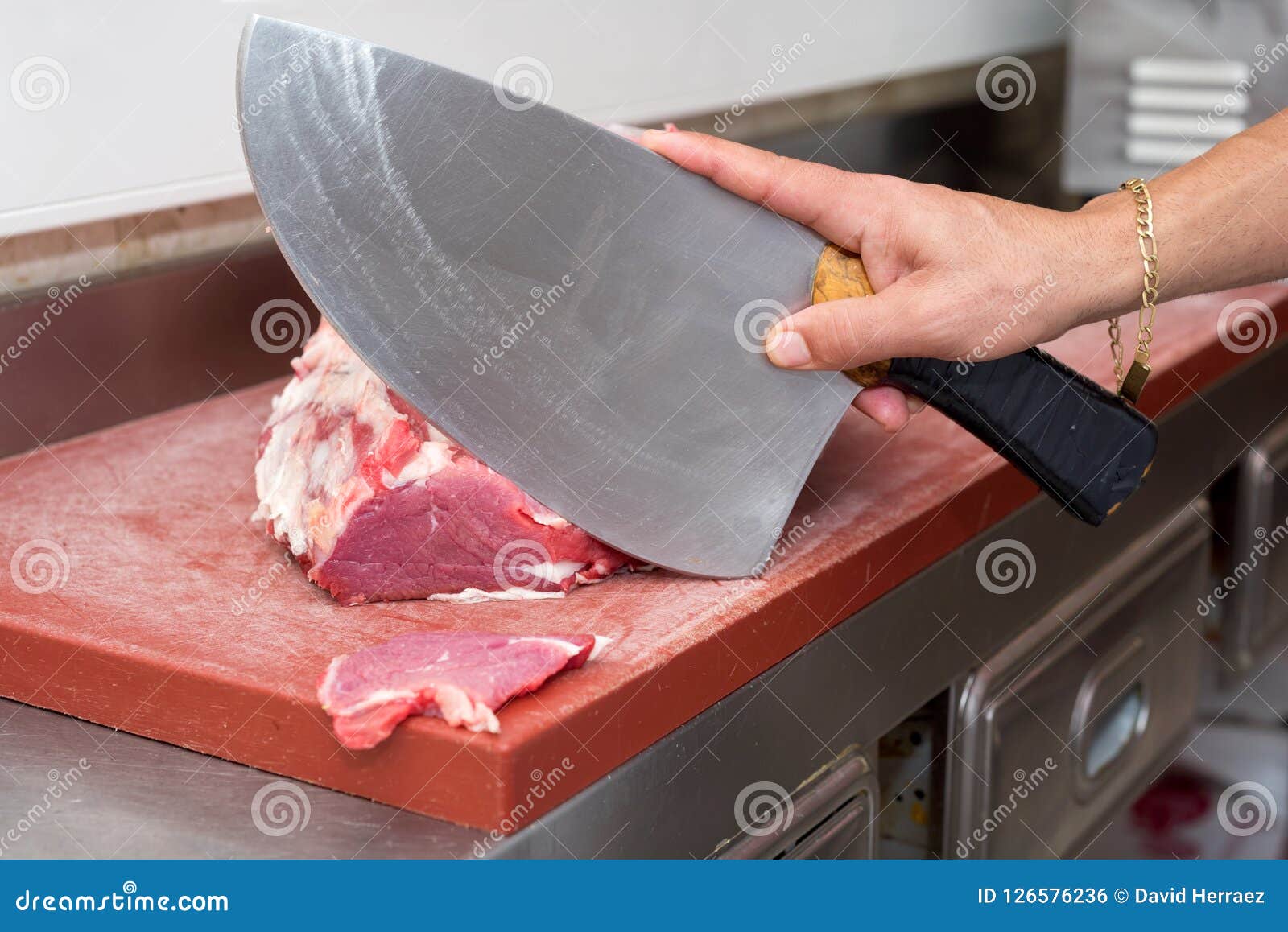 Butcher Cutting Steaks at the Butcher Shop Stock Photo - Image of ...