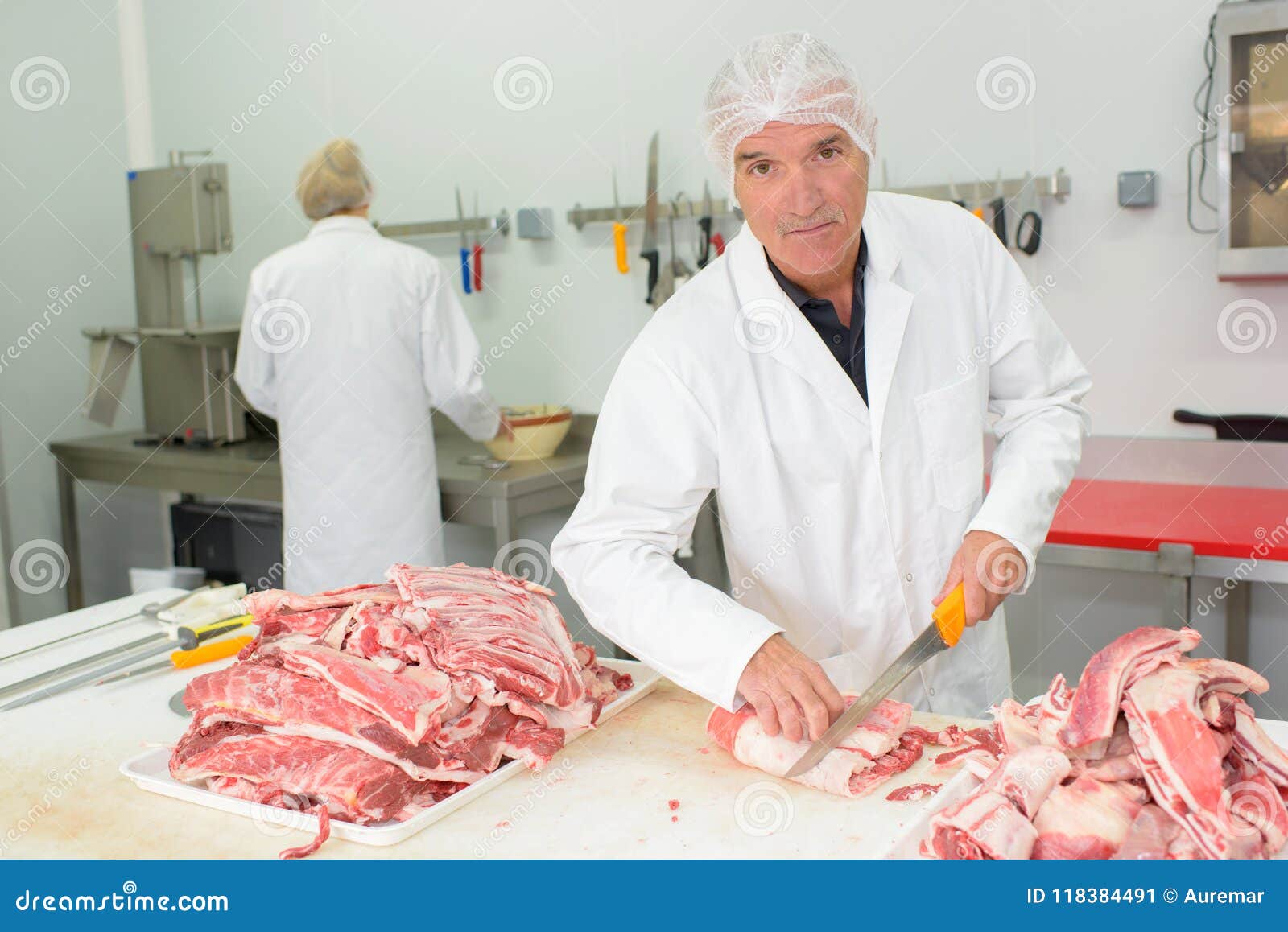 Butcher cutting up meat stock image. Image of looking - 118384491