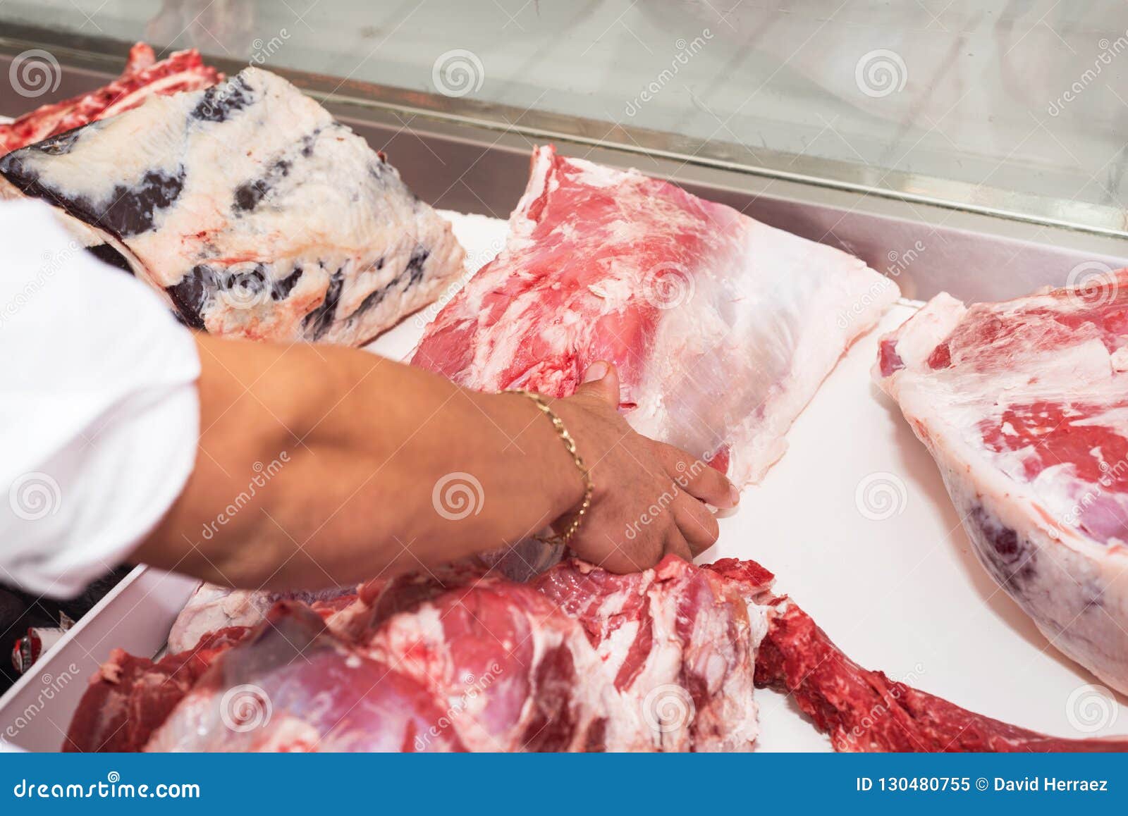 Butcher Offering Fresh Meat at Display in Butchery Stock Image - Image ...