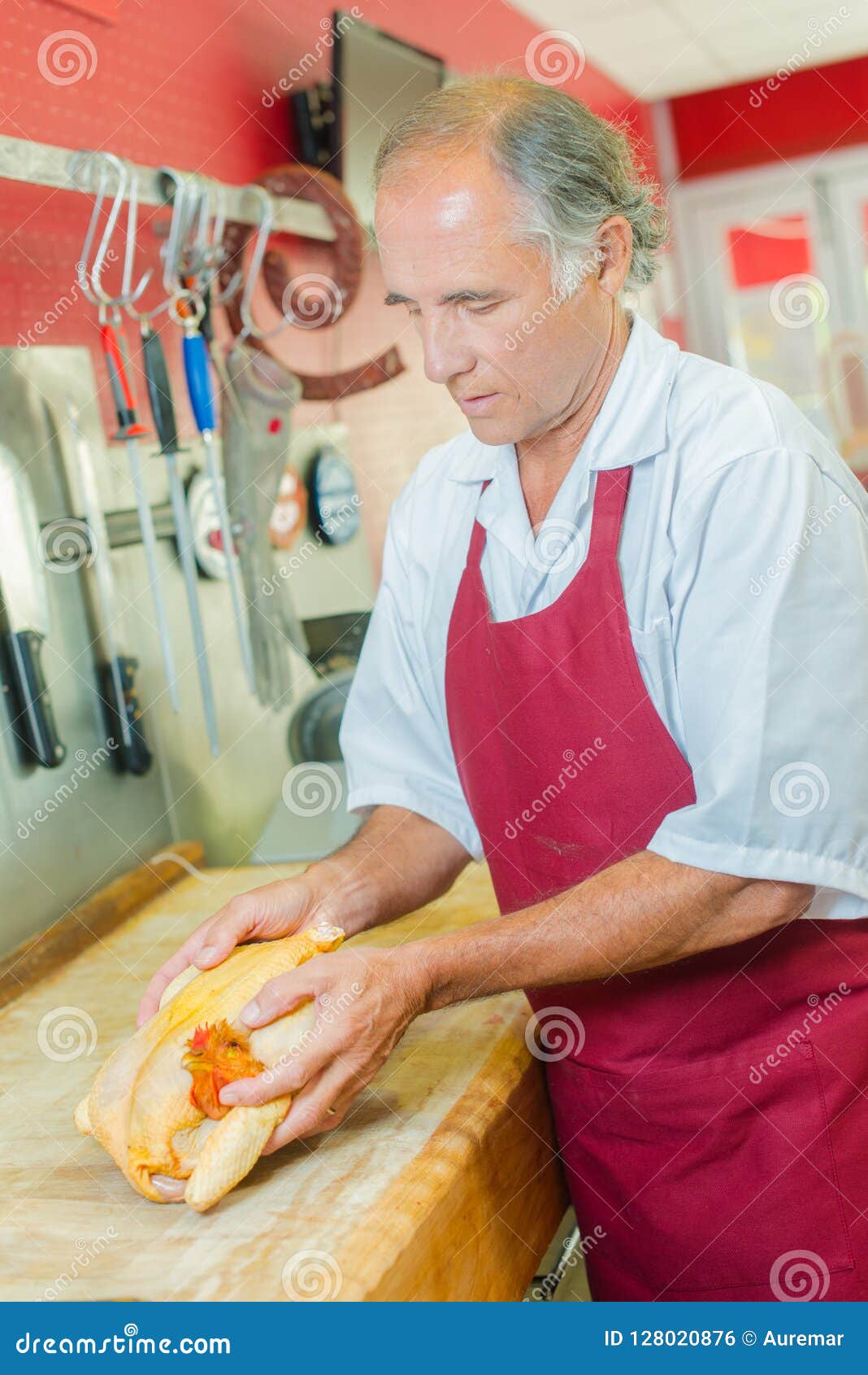 Butcher Preparing a Chicken Stock Photo - Image of meal, grocery: 128020876