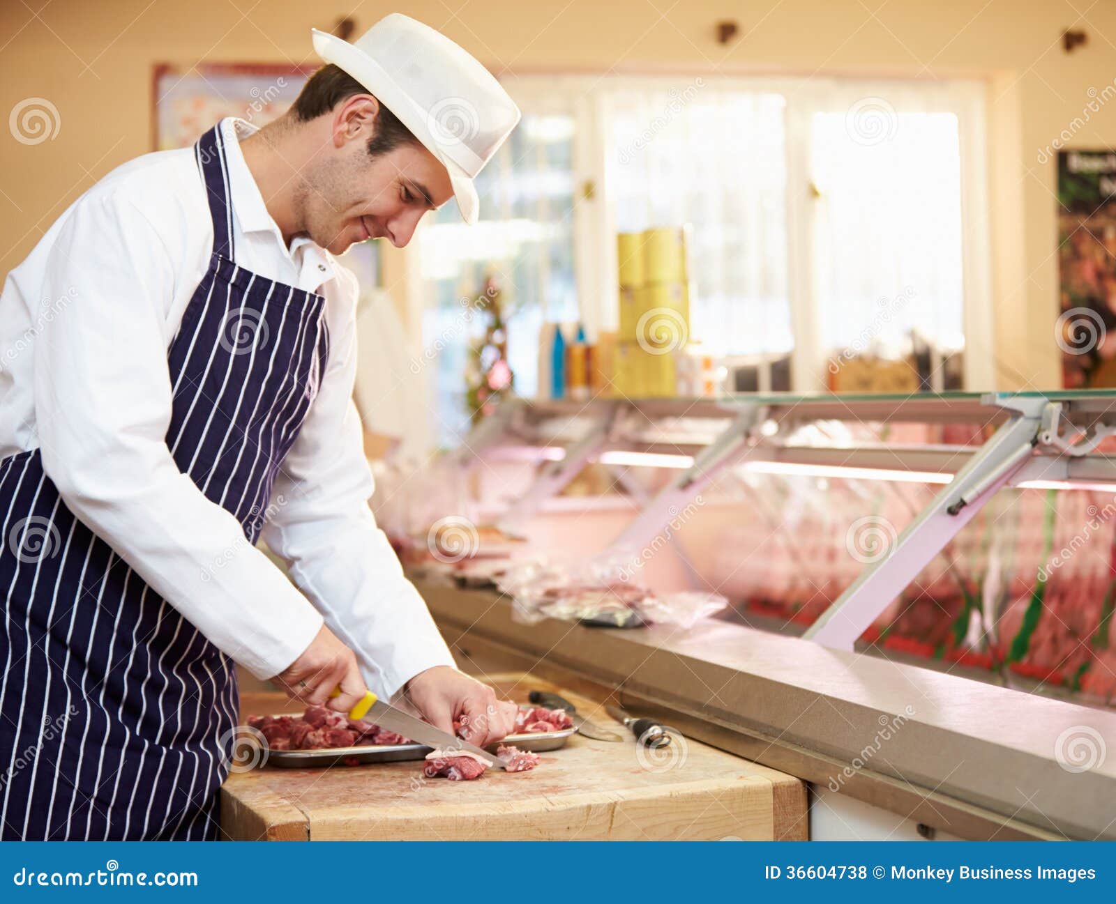 Butcher Preparing Meat in Shop Stock Photo - Image of food, shop: 36604738