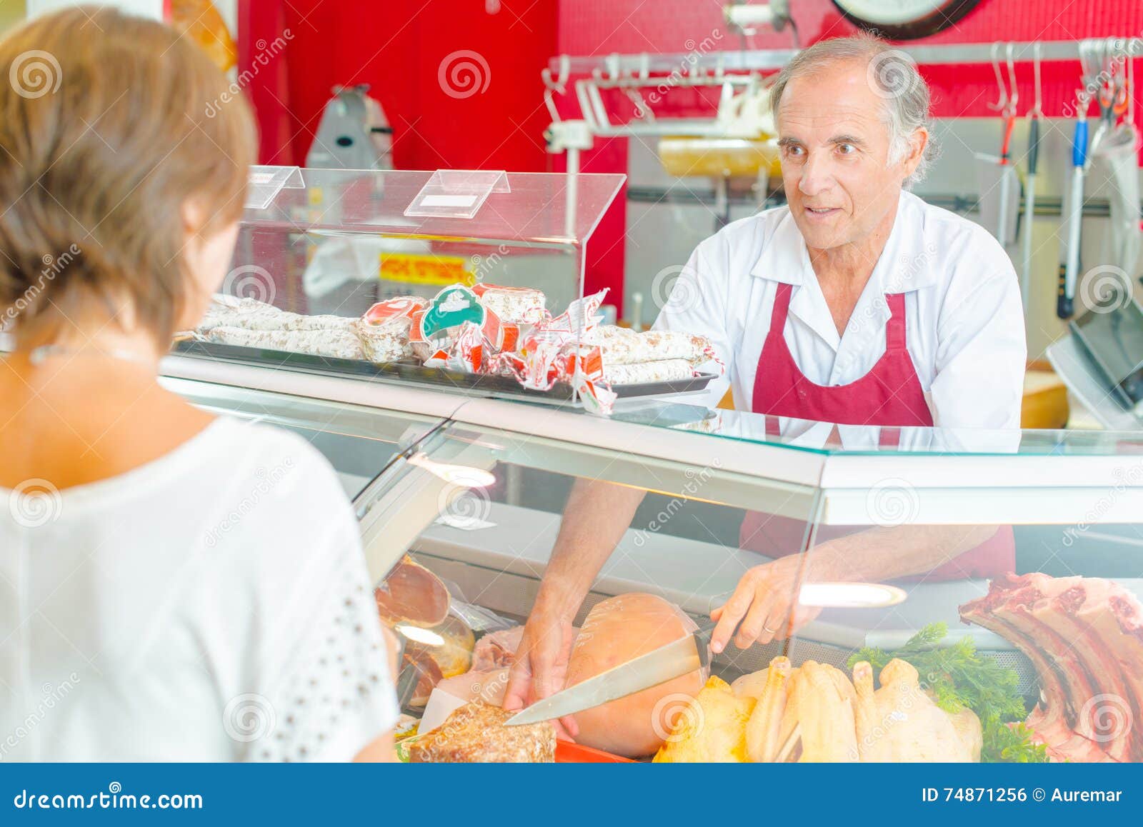 Butcher Serving Customer at Deli Counter Stock Photo - Image of butcher ...