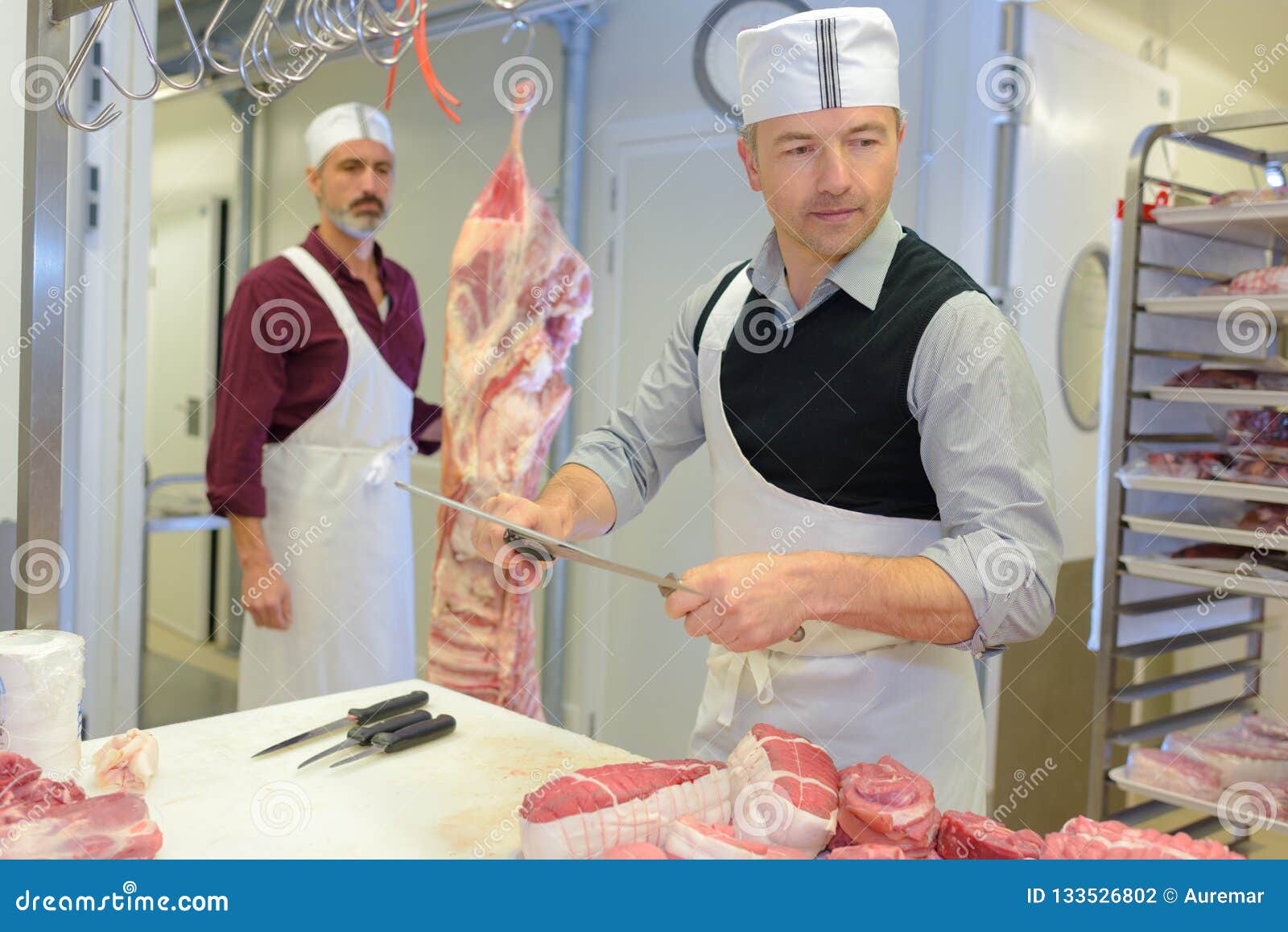 Butcher Sharpening Knife on Steel Stock Photo - Image of caucasian ...