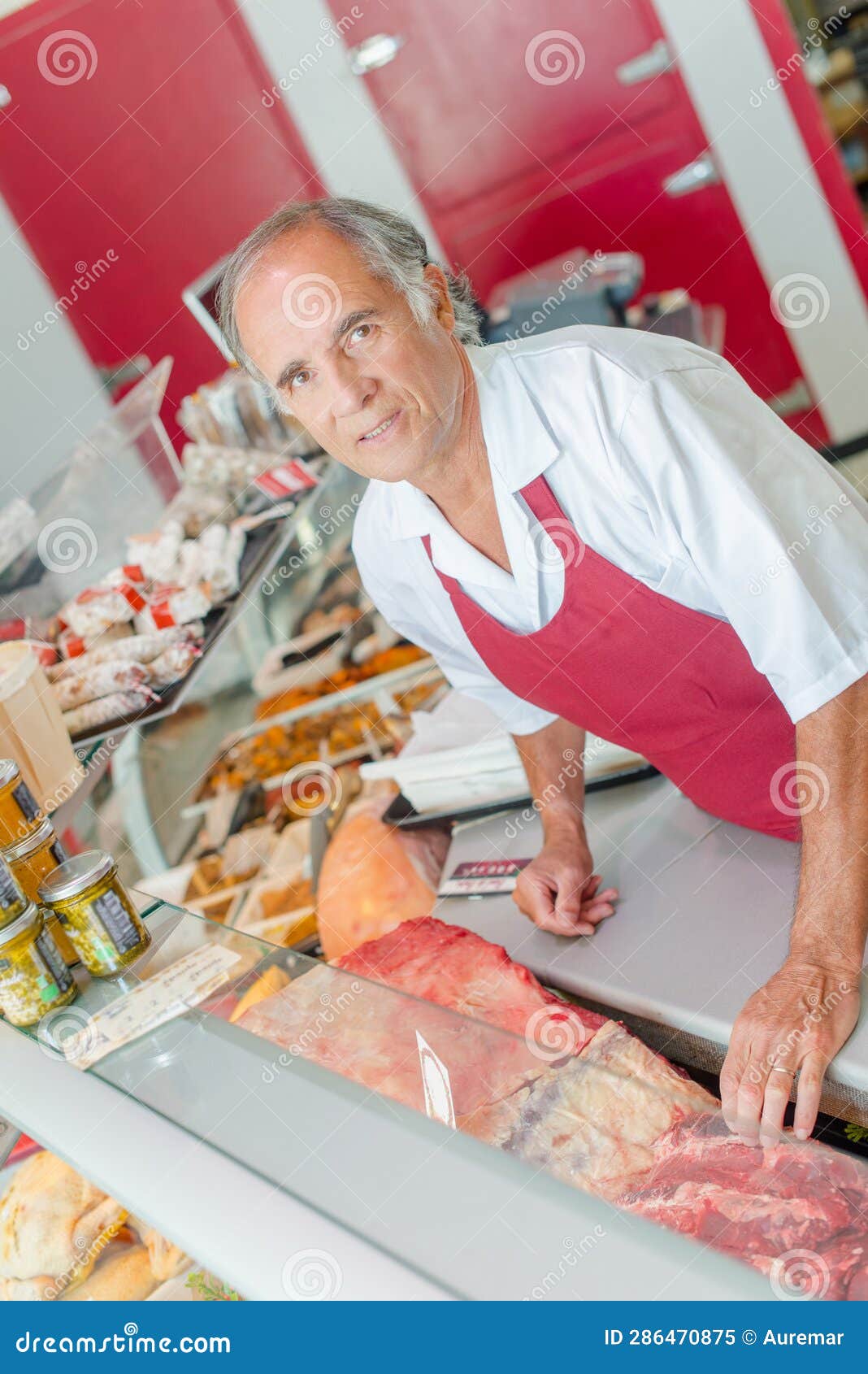 Butcher in shop stock image. Image of jars, shopkeeper - 286470875