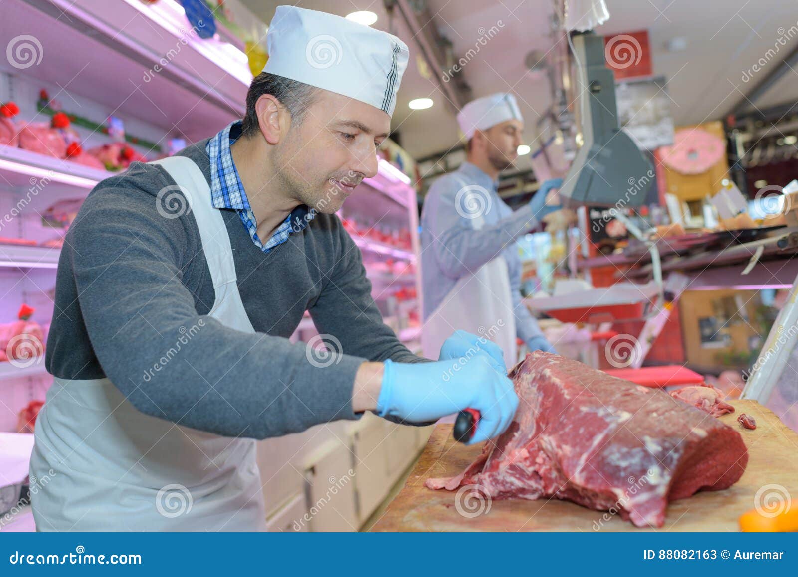 Butcher Teaching Young One How To Sell Meat Stock Image - Image of ...