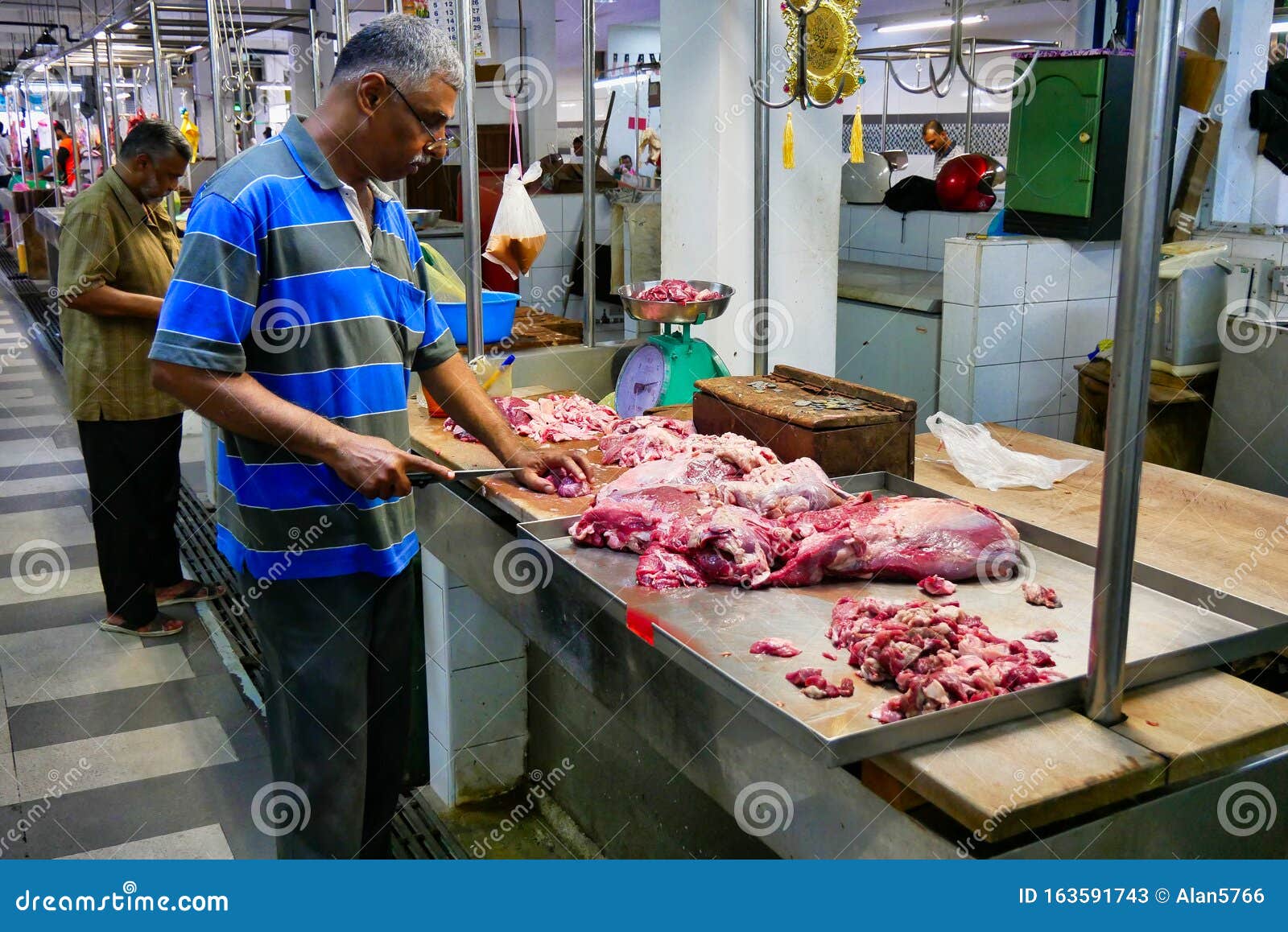 A Butcher at Work in a Market in Georgetown, Penang Editorial Stock ...