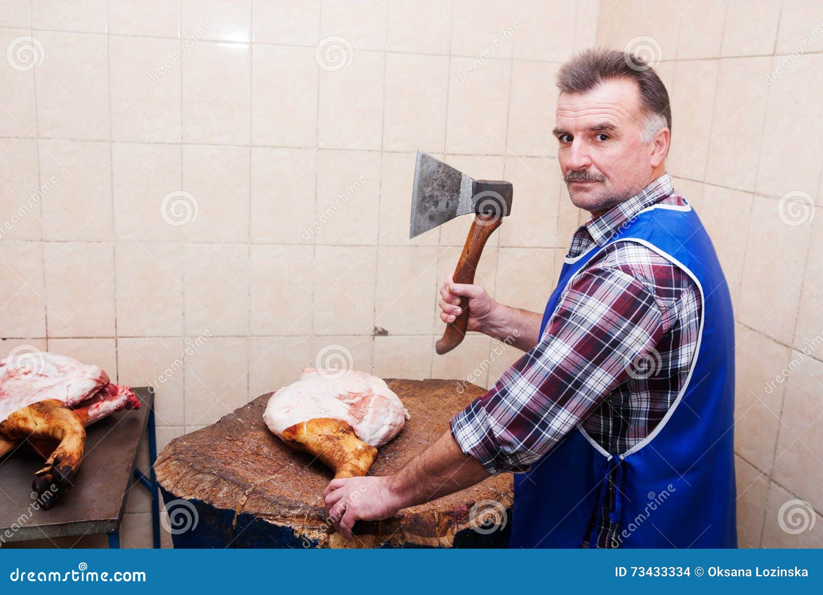 Butcher at work stock photo. Image of profession, shop - 73433334