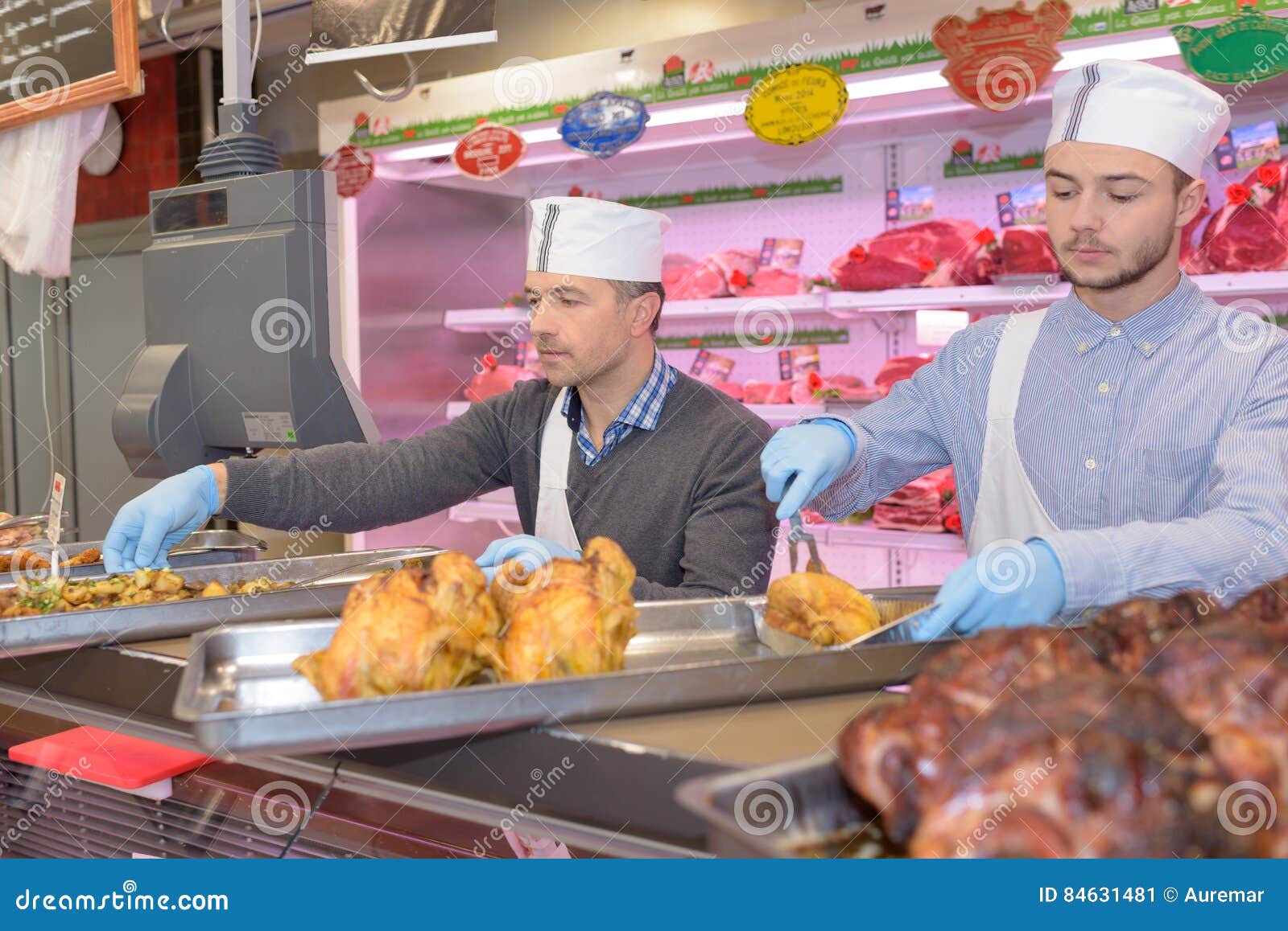 Butchers Displaying Cooked Chicken on Top Counter Stock Image - Image ...