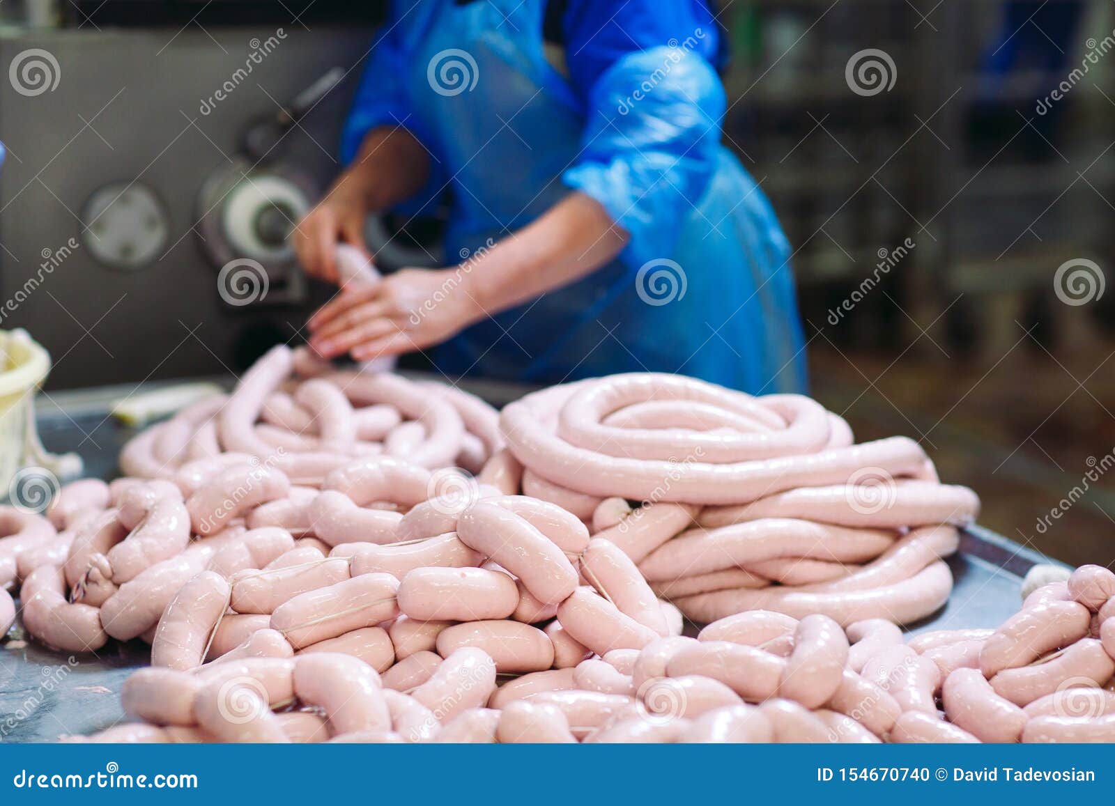 Butchers Processing Sausages at a Meat Factory. Stock Photo - Image of ...