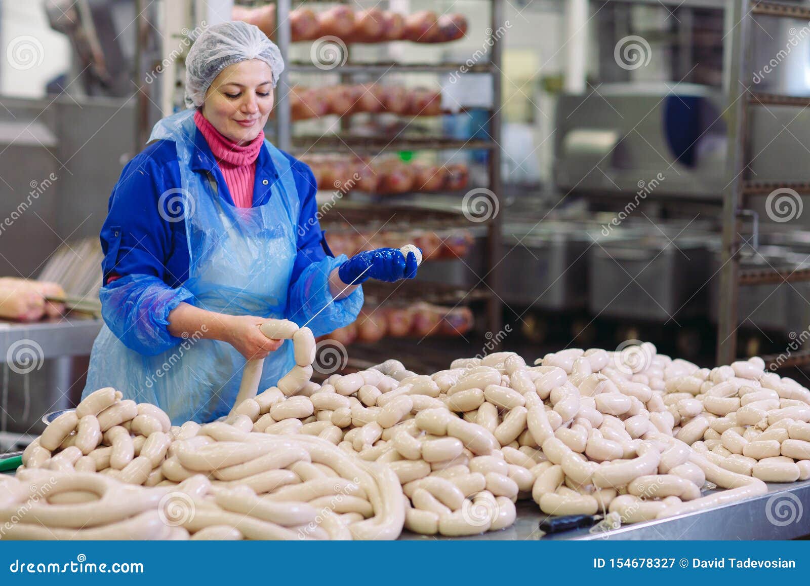 Butchers Processing Sausages at a Meat Factory. Stock Image - Image of ...