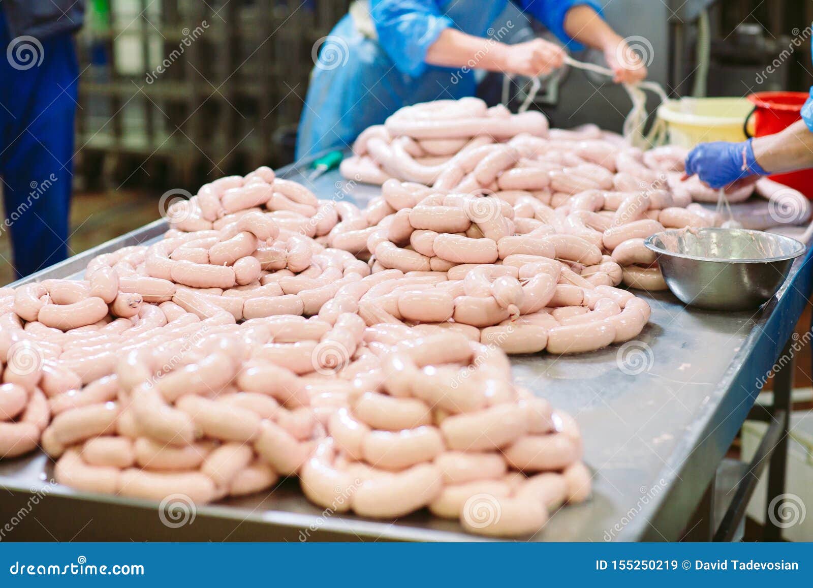 Butchers Processing Sausages at the Meat Factory. Stock Image - Image ...