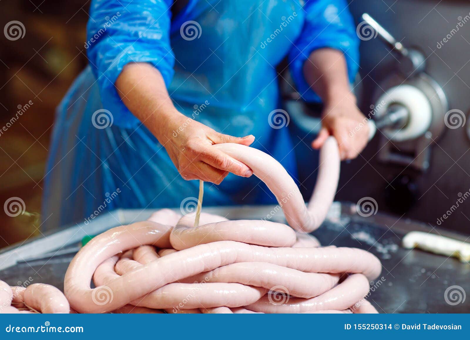 Butchers Processing Sausages at the Meat Factory. Stock Photo - Image ...