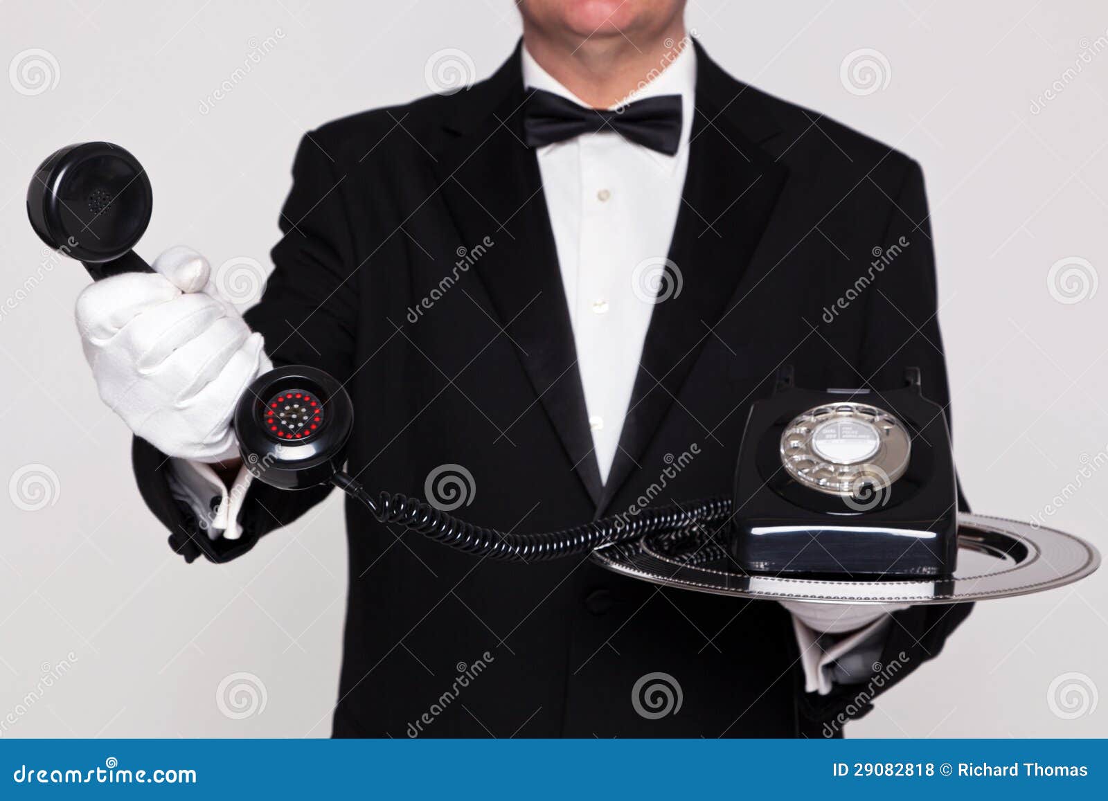 Butler Handing You a Telephone Stock Photo - Image of passing, formal ...