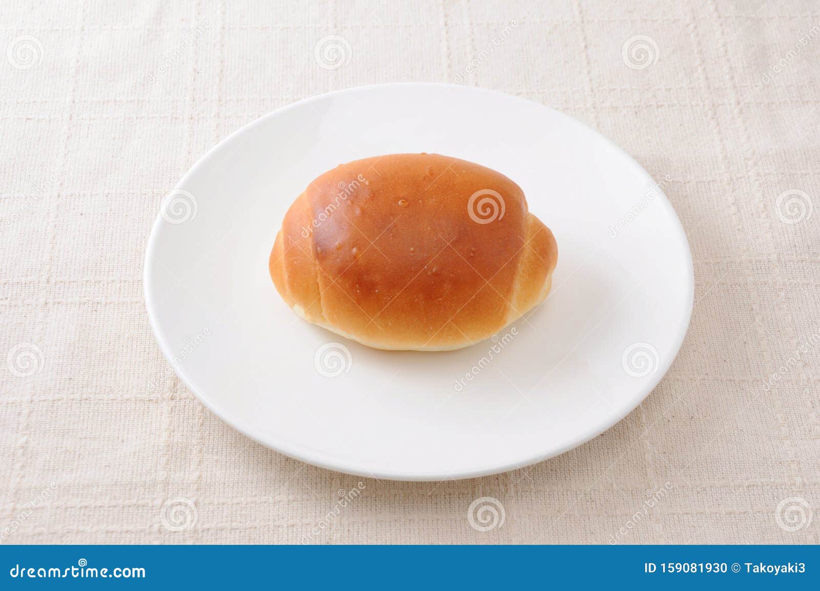 Butter Bread Roll on a Plate on Tablecloth Stock Photo - Image of ...