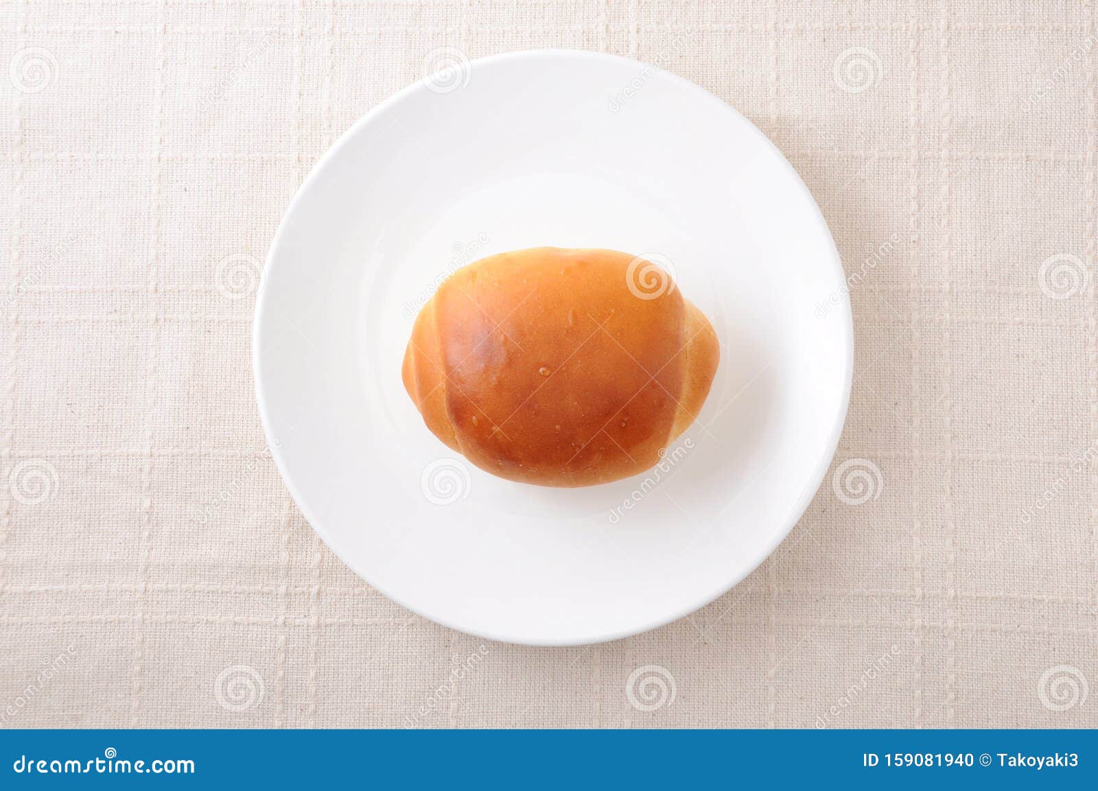 Butter Bread Roll on a Plate on Tablecloth Stock Photo - Image of ...