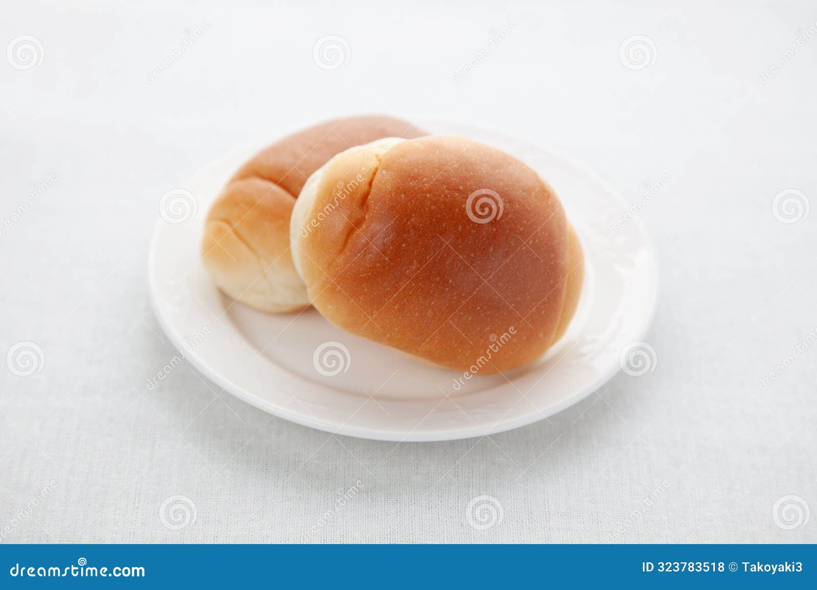 Butter Bread Table Rolls on Plate Isolated on Table Stock Photo - Image ...