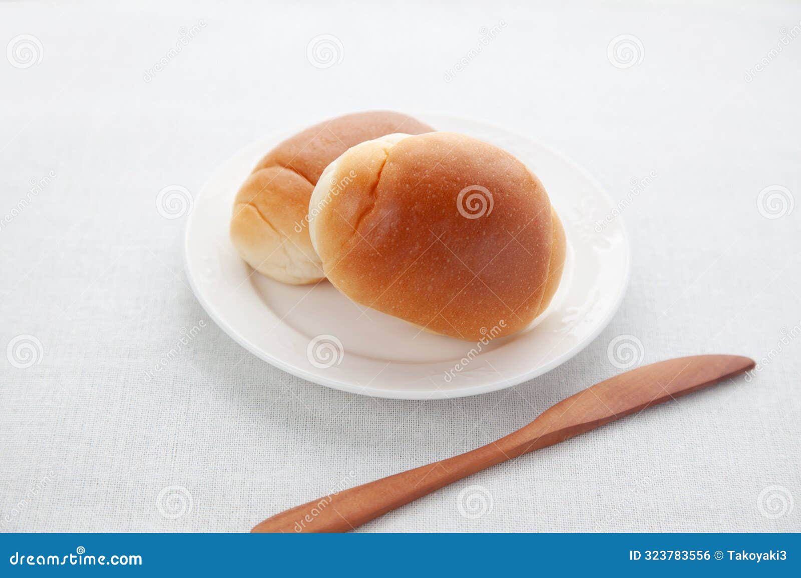 Butter Bread Table Rolls on Plate Isolated on Table Stock Photo - Image ...