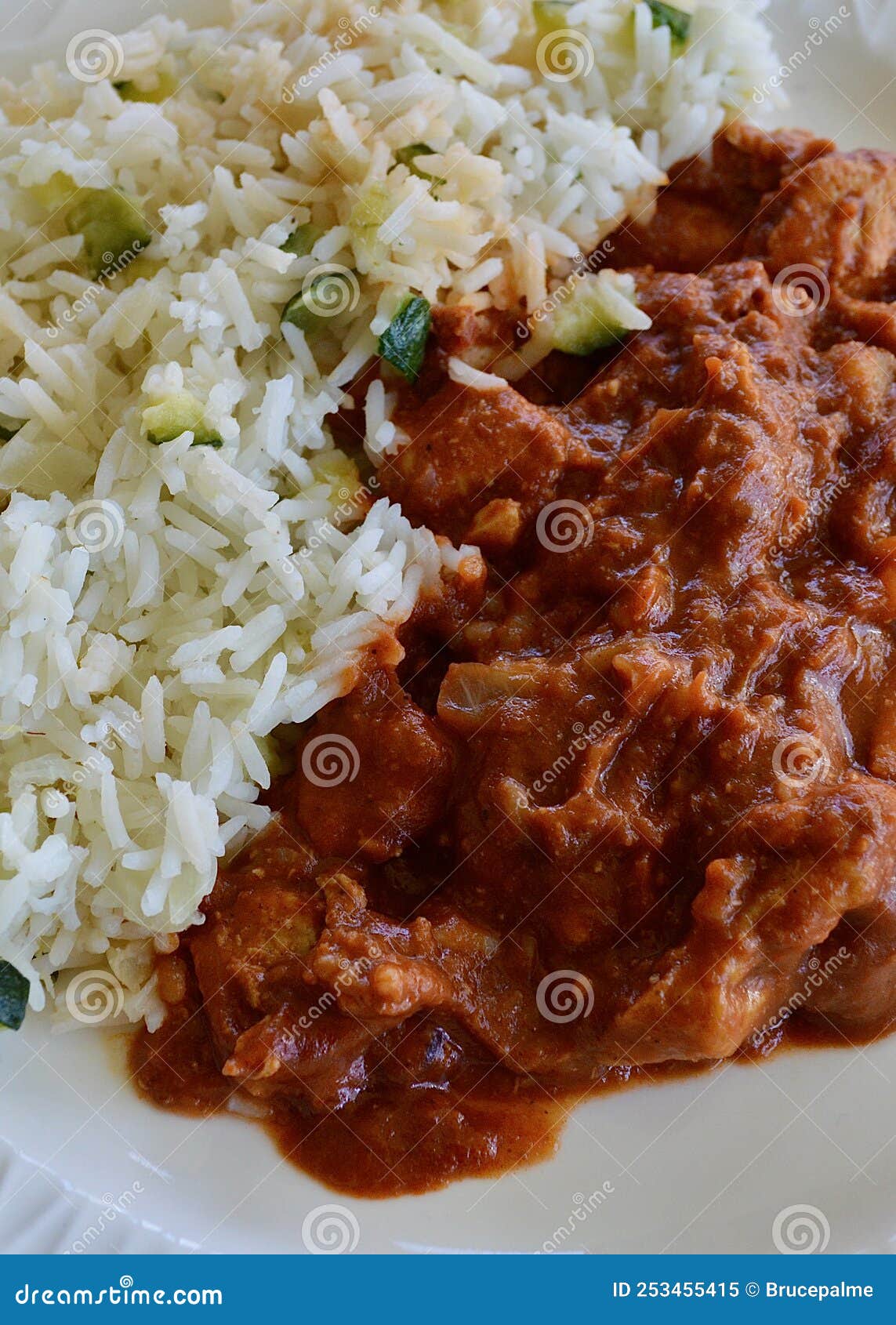Butter Chicken and Basmati Rice on a White Plate Stock Image - Image of ...