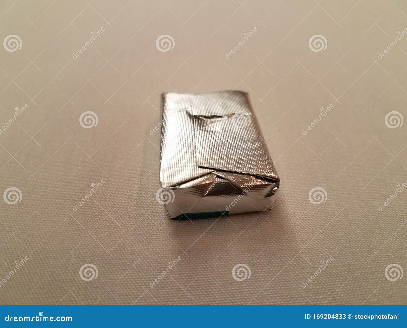 Butter in Silver Foil Wrapper on Surface or Table Stock Image - Image ...