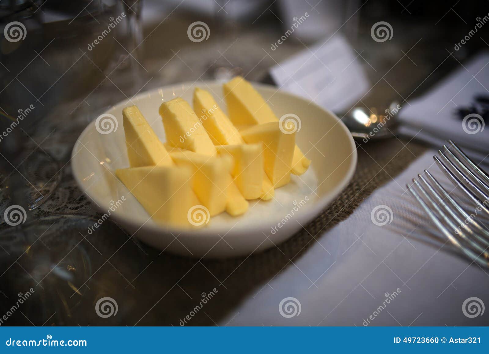 Butter cut into triangles stock photo. Image of milk - 49723660