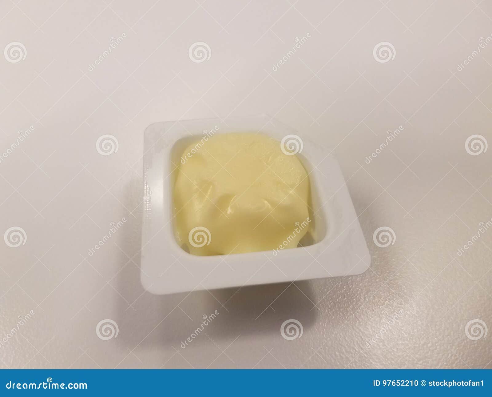 Butter in a Plastic Container Stock Photo - Image of condiment, yellow ...