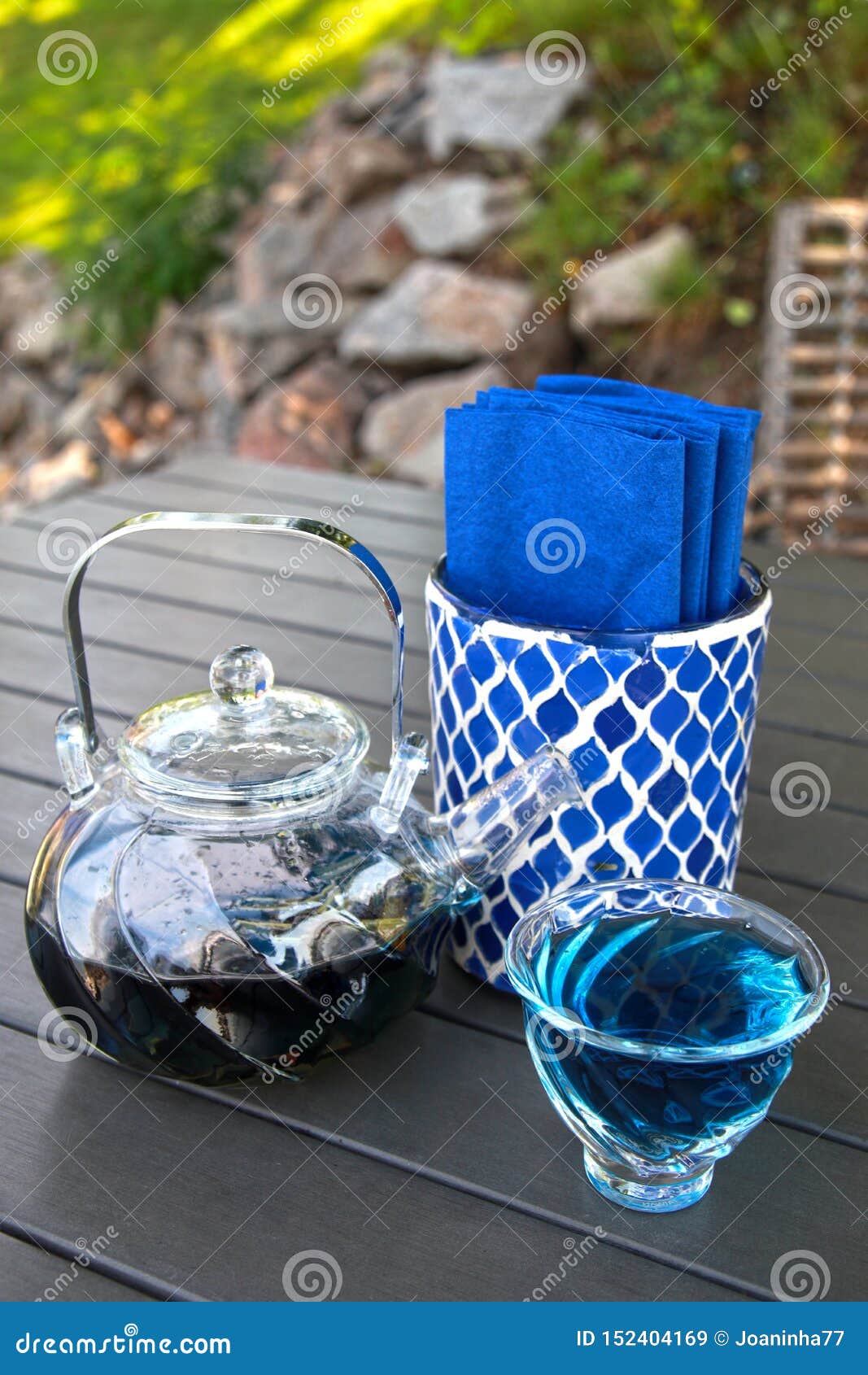 Blue Tea in a Cup and a Teapot on the Table Stock Image - Image of ...