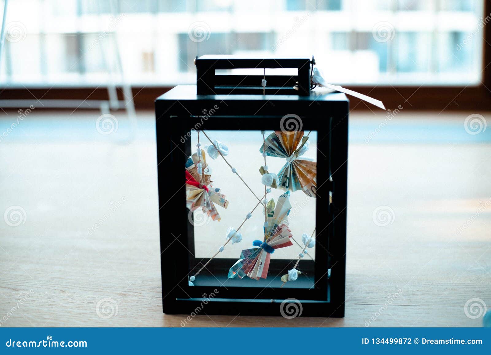 Butterfly`s Shaped from Money Trapped in a Latern Stock Photo - Image ...