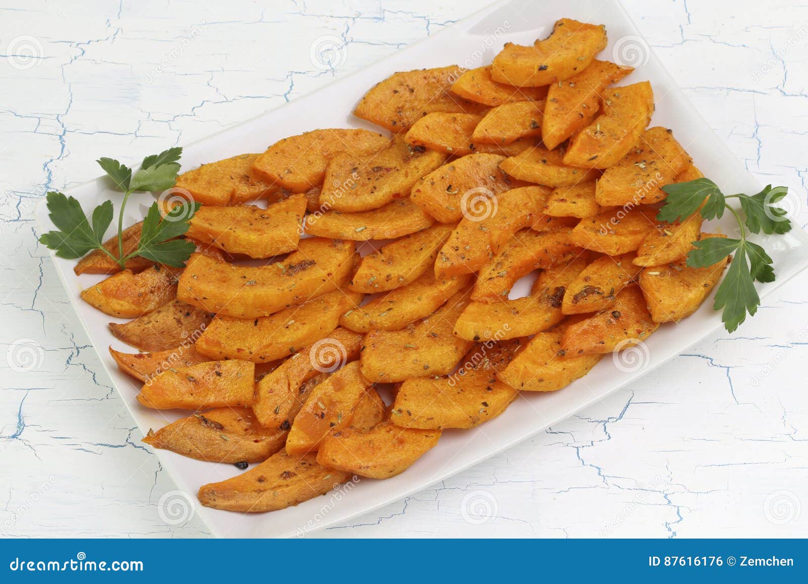 Butternut Slices Baked in Spicy Dressing Stock Photo - Image of garnish ...