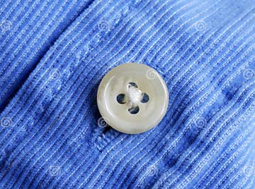 A button from a shirt stock photo. Image of hand, button - 12707698