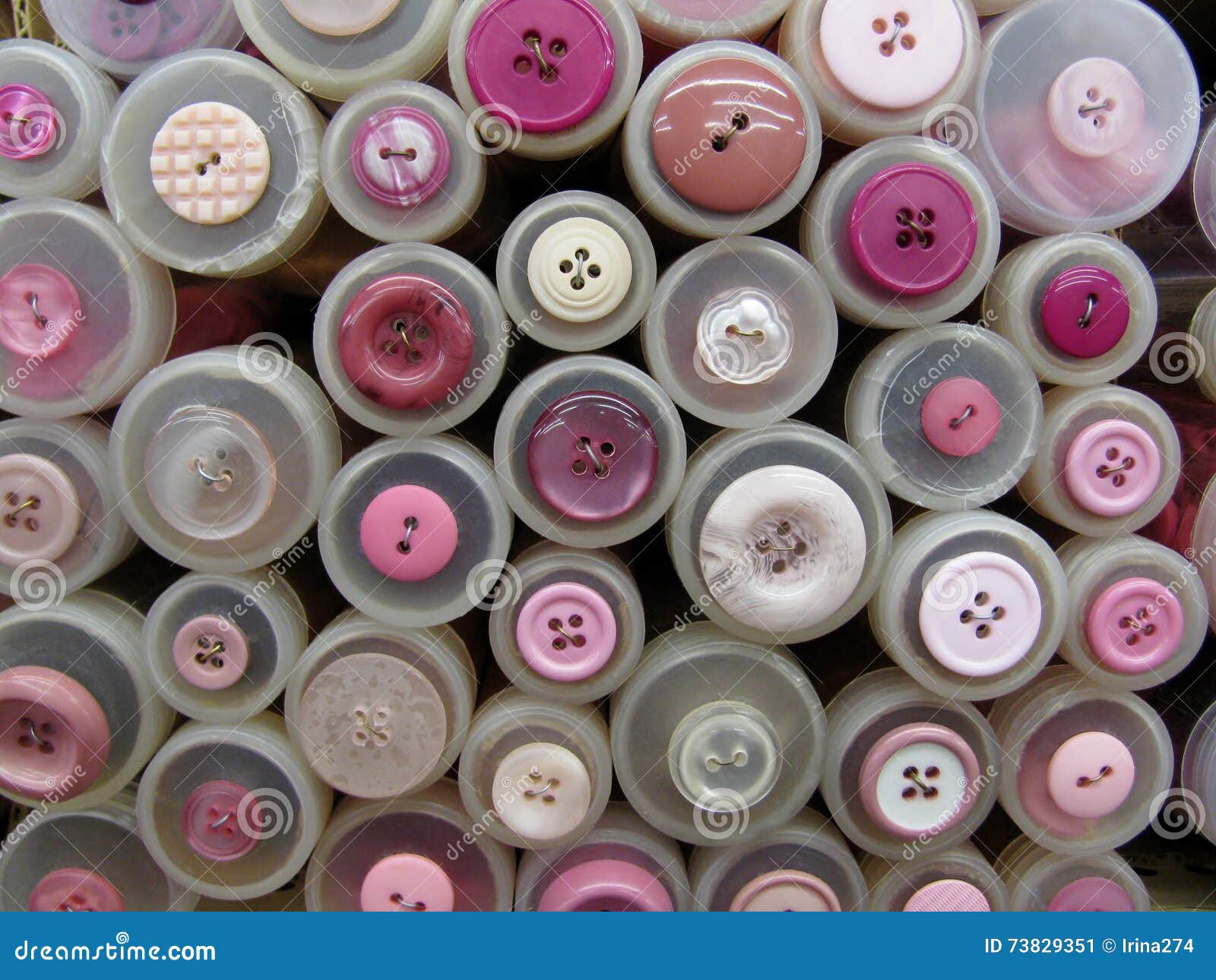 Pink Buttons in Tube Displays on a Store Shelf Stock Image - Image of ...