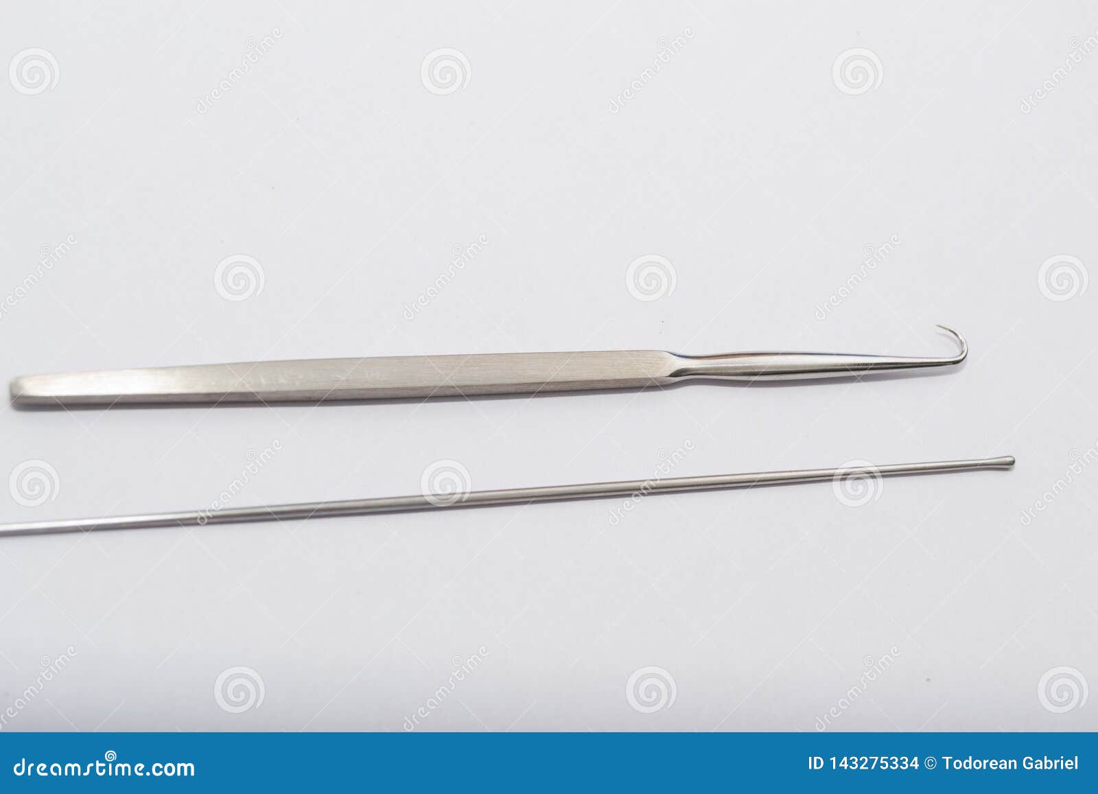 Buttoned Probe and Hook on Grey Surface Stock Photo - Image of steel ...