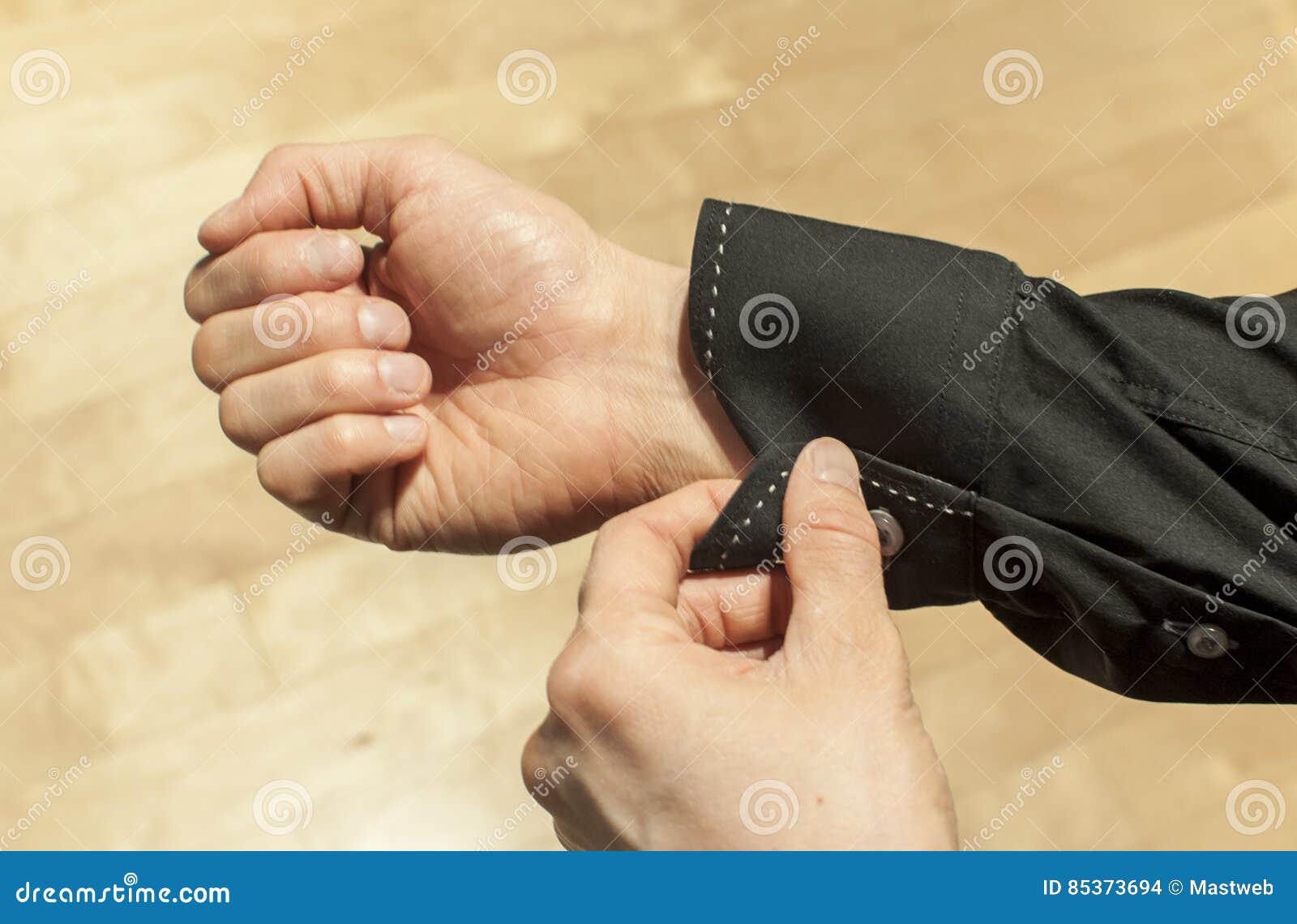 Buttoning the sleeve stock photo. Image of button, gentleman - 85373694