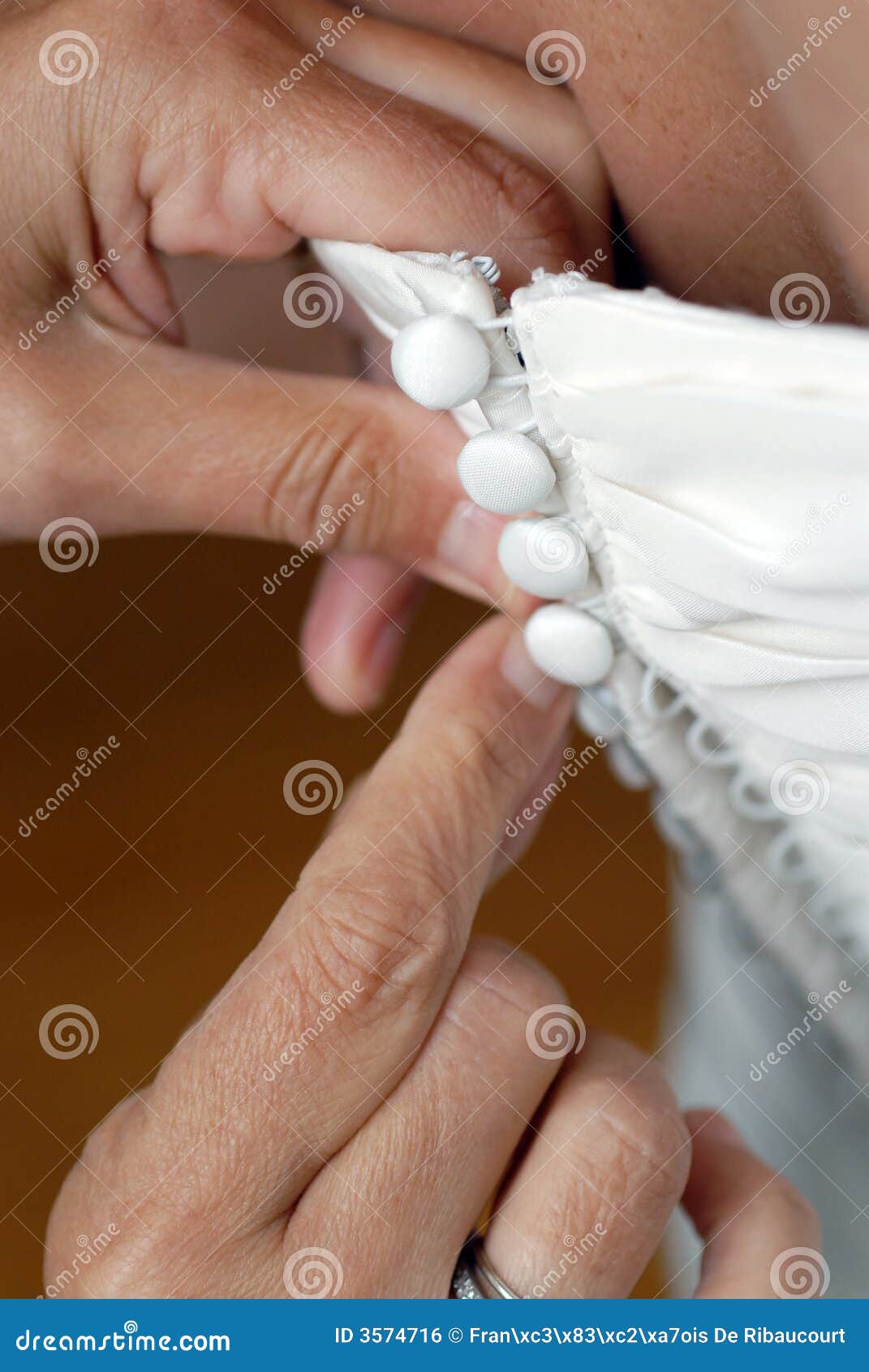 Buttoning up wedding dress stock photo. Image of helping - 3574716