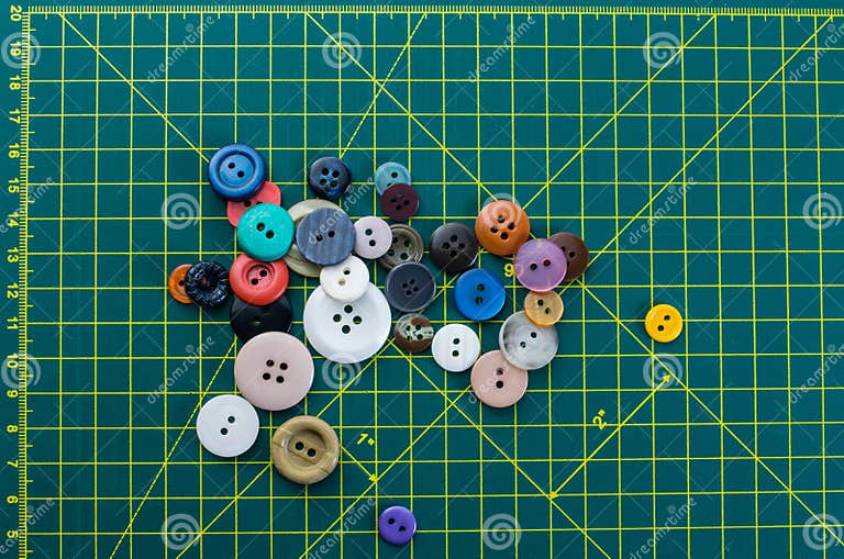 Buttons on a mat cutting stock illustration. Illustration of colorful ...