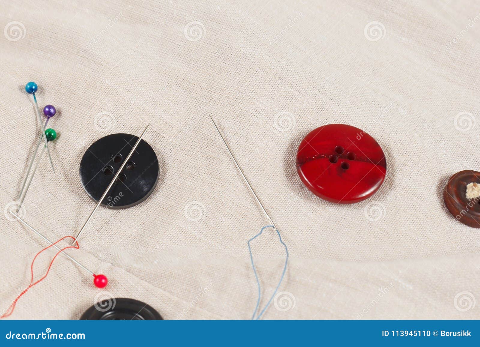 Buttons, Pins and Needles with Threads on Canvas Closeup Stock Photo ...