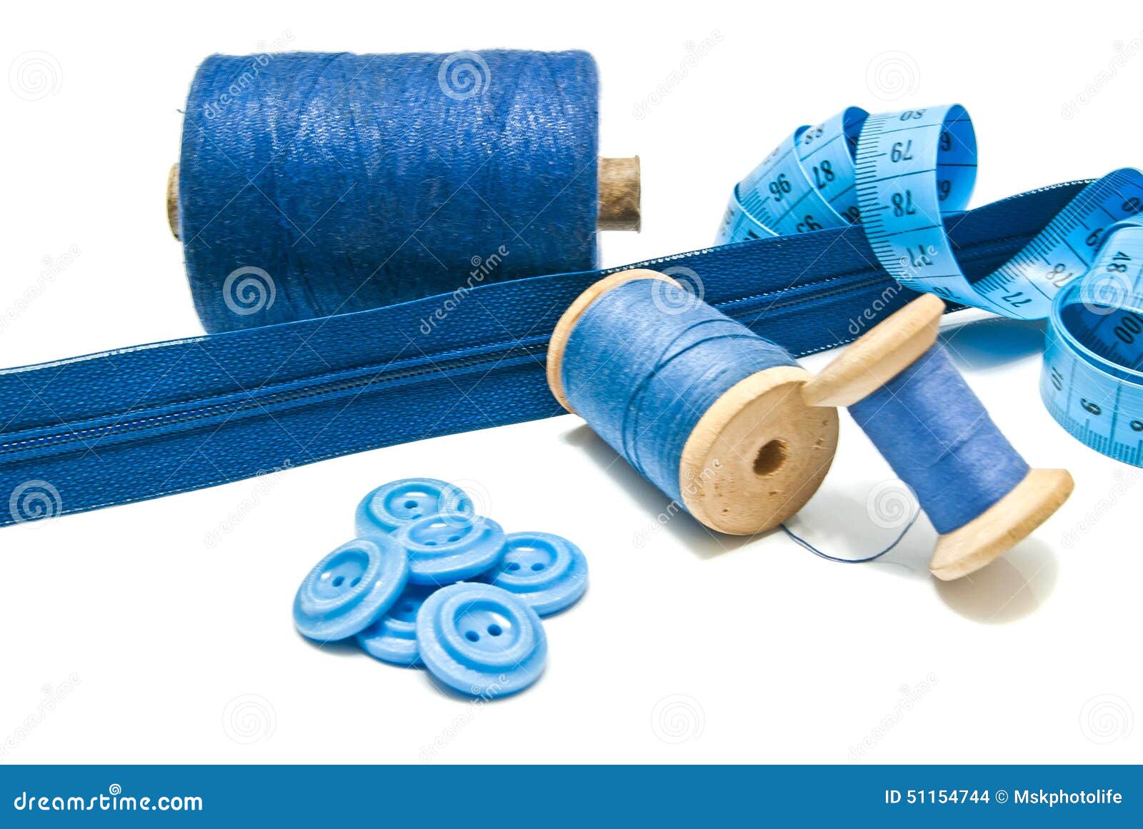 Buttons, Zipper and Spools of Blue Thread Stock Photo - Image of item ...