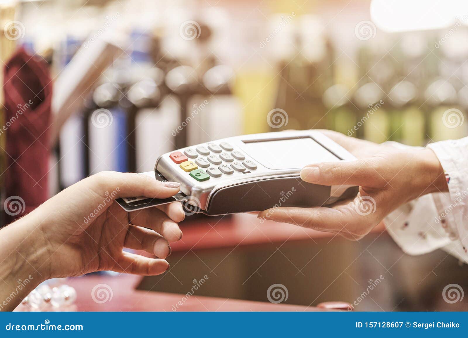 Buyer Buys the Goods in the Store. Process of Paying for Goods with a ...