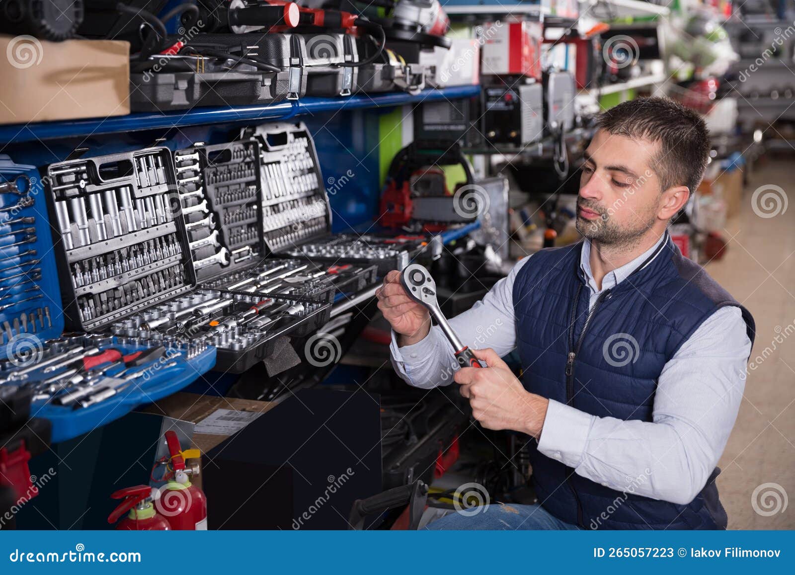 Buyer is choosing ratchet stock image. Image of building - 265057223