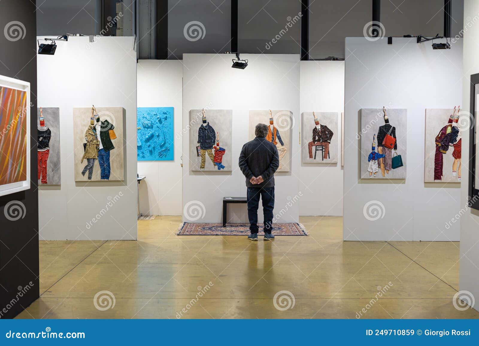 Buyer Evaluating the Purchase of Works in a Modern Art Gallery ...