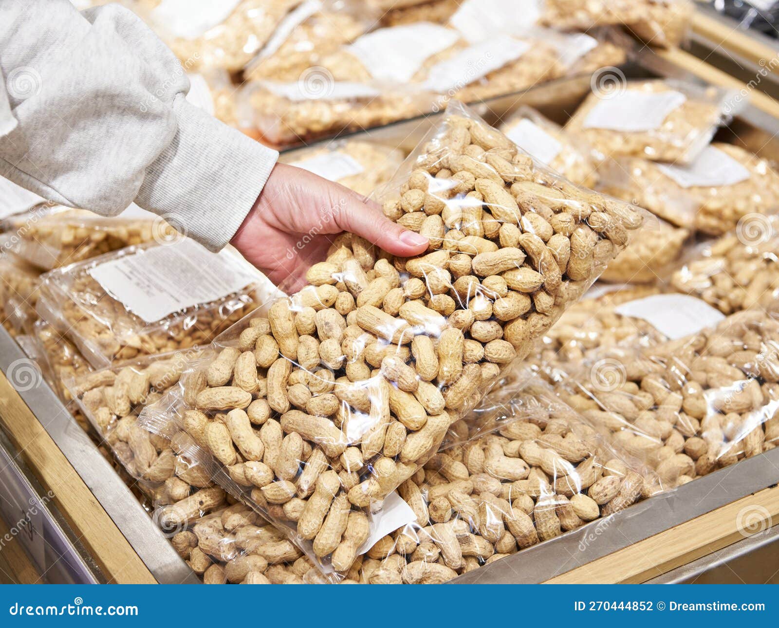 Buyer with Peanuts in Store Stock Photo - Image of supermarket, organic ...