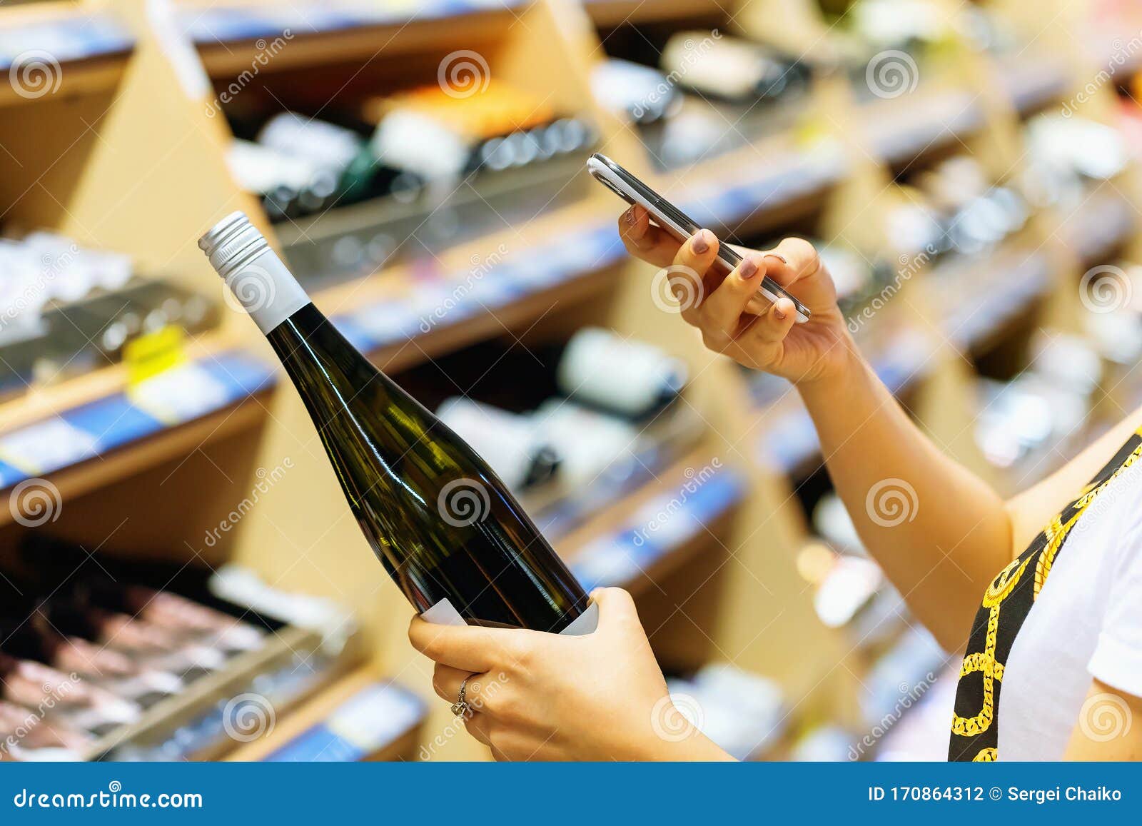 The Buyer Scans the Goods by Barcode in the Liquor Store Stock Photo ...
